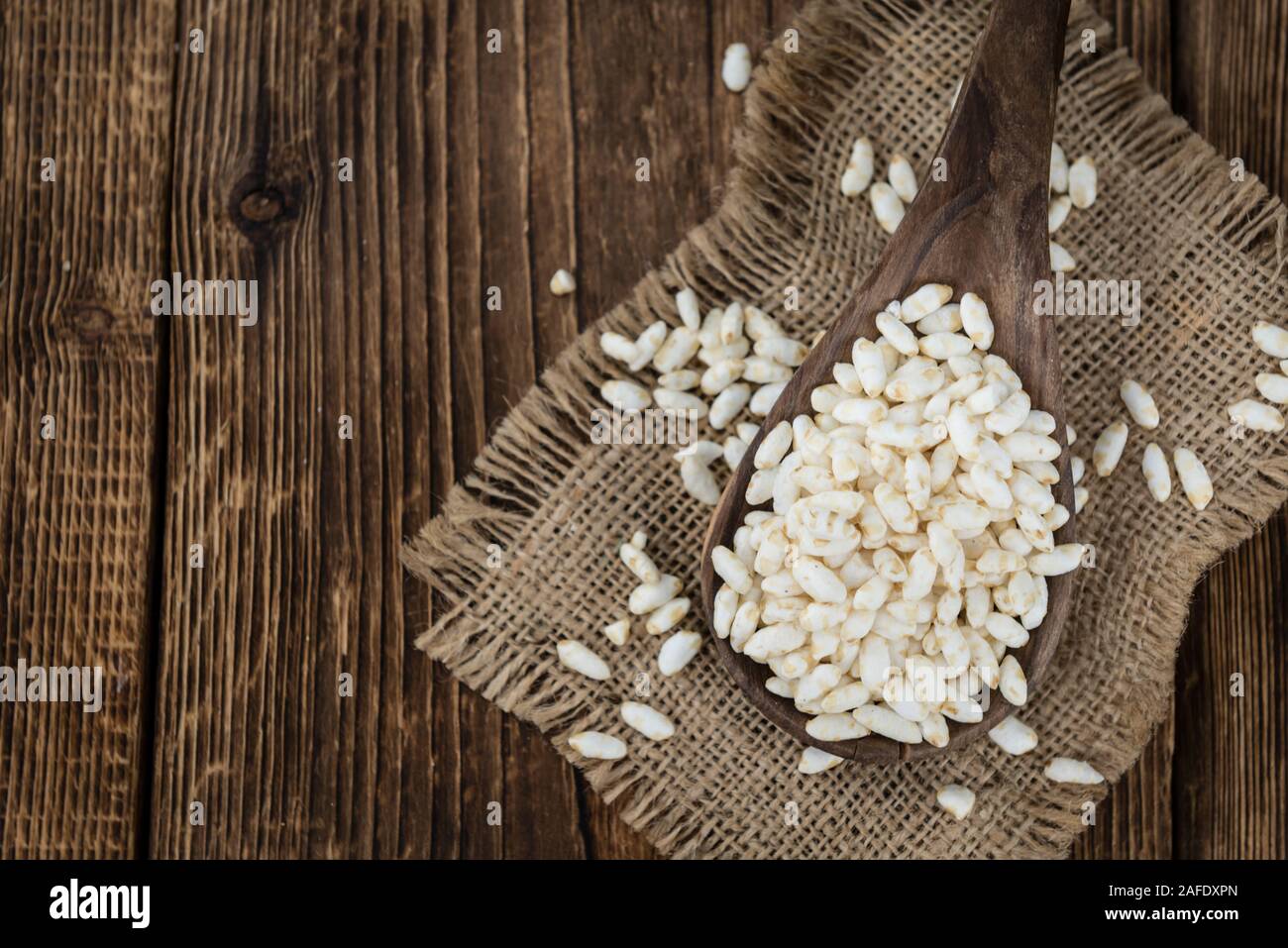 Old wooden table with puffed Rice (detailed close-up shot Stock Photo ...