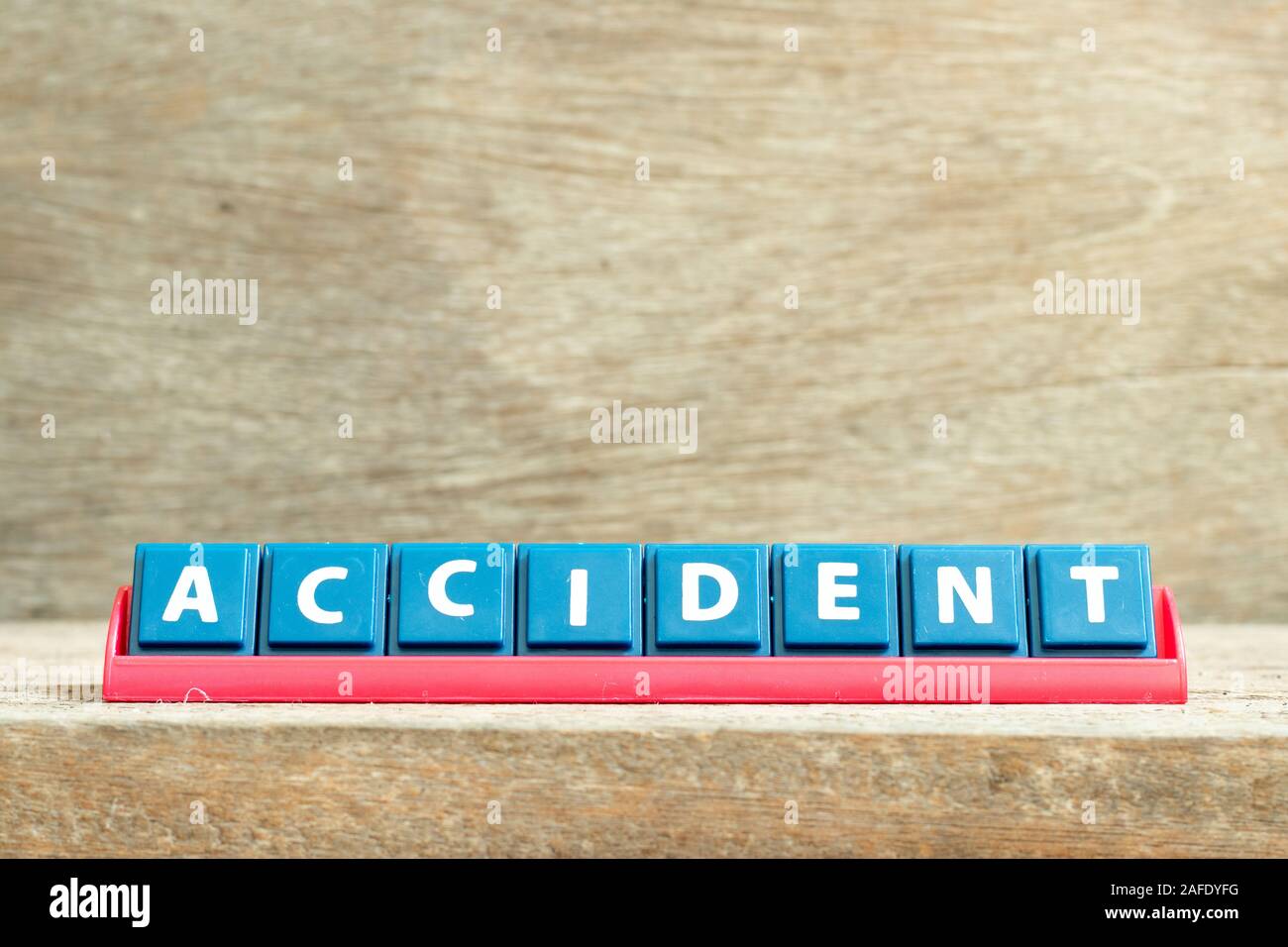 Tile letter on red rack in word accident on wood background Stock Photo ...