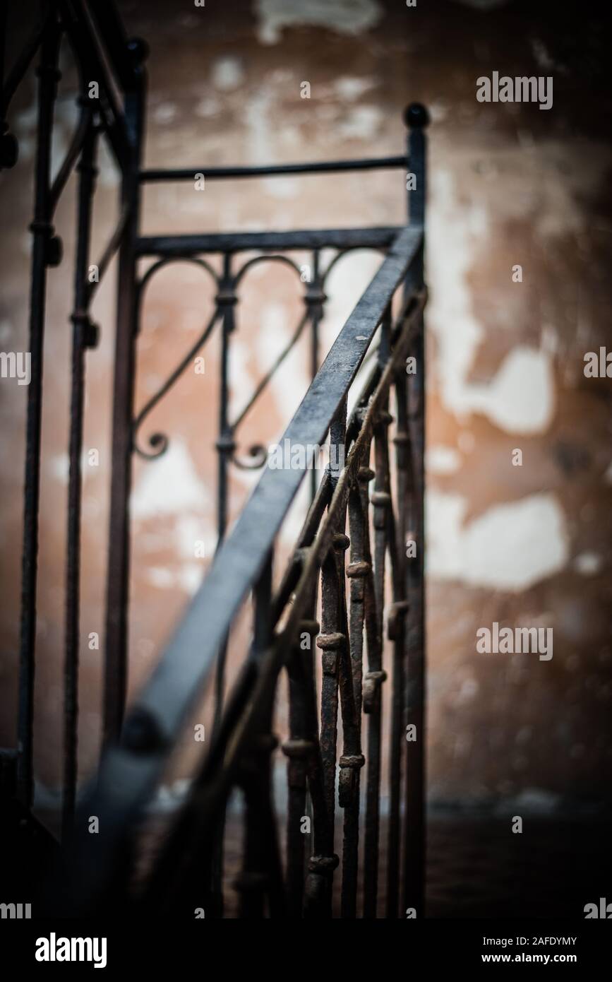 Beautiful old wrought iron staircase banister handrail. The old rusted ...