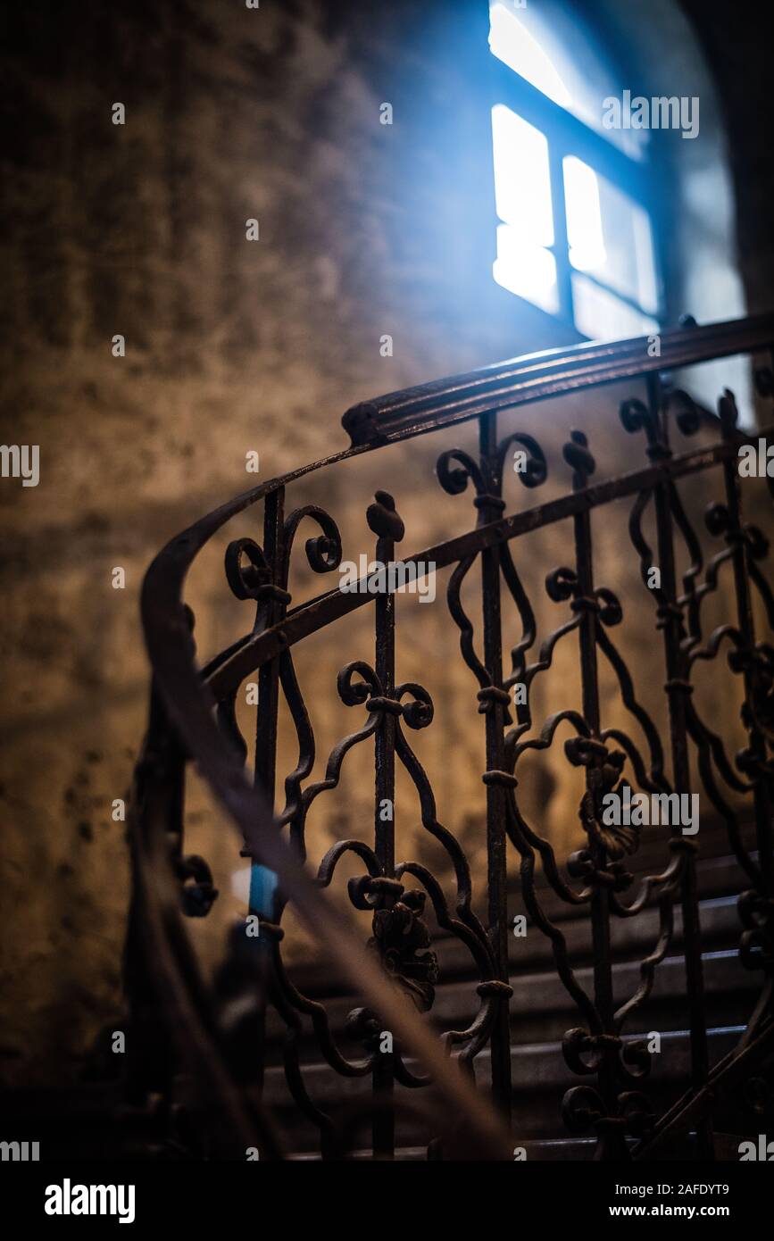 Beautiful old wrought iron staircase banister handrail. The old rusted ...