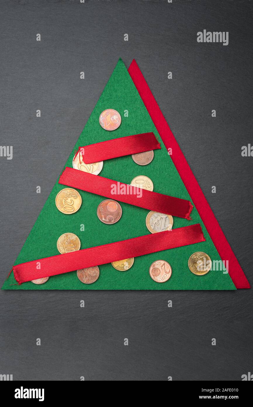Green and red Christmas tree shape with baubles made out of Euro coins ...