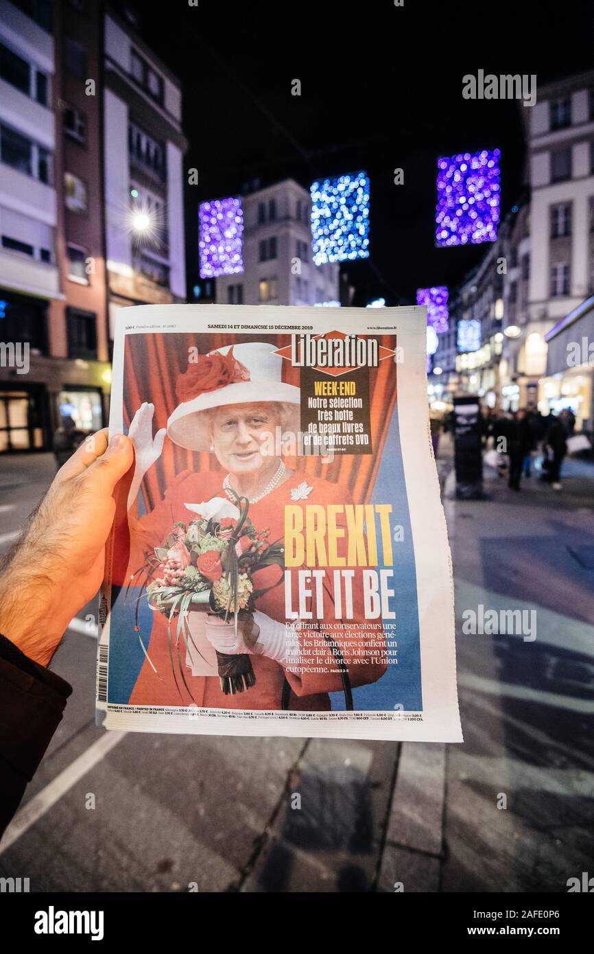 Paris, France - Dec 14, 2019: Man holding French Liberation newspaper ...