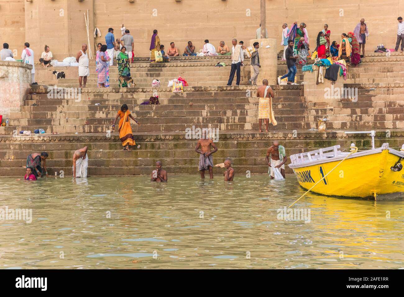 People bathing in the river Ganges at the Raja Ghat in Varanasi, India ...