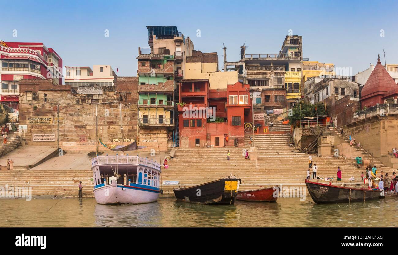 Boats and historic stairs at the Narad Ghat in Varanasi, India Stock ...