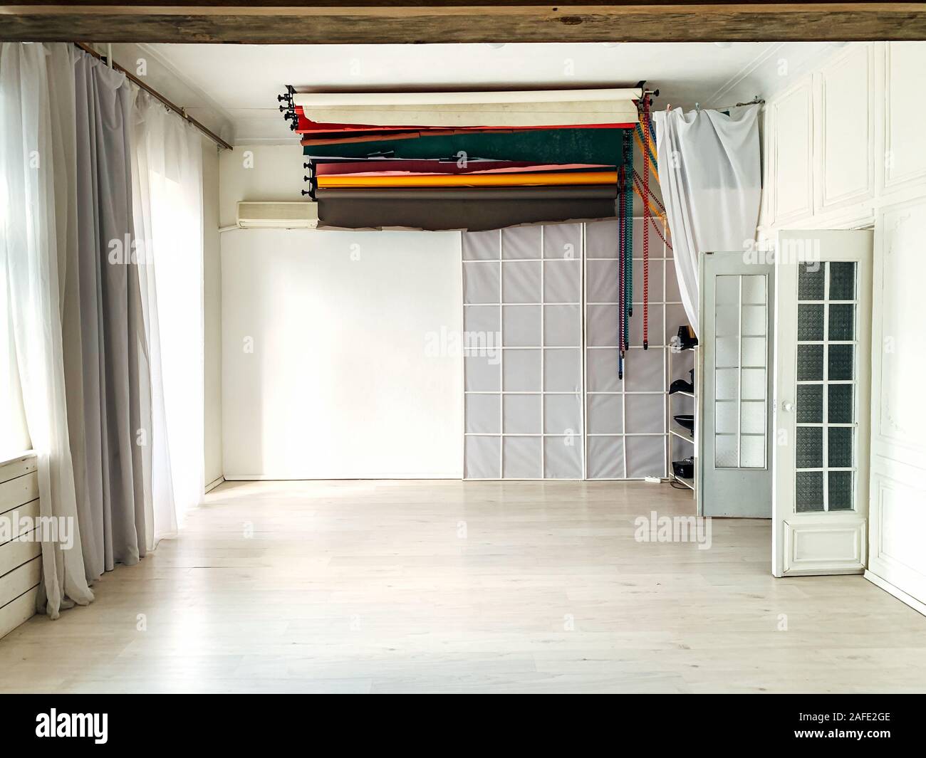 white photo studio with backgrounds accessories of a professional ...
