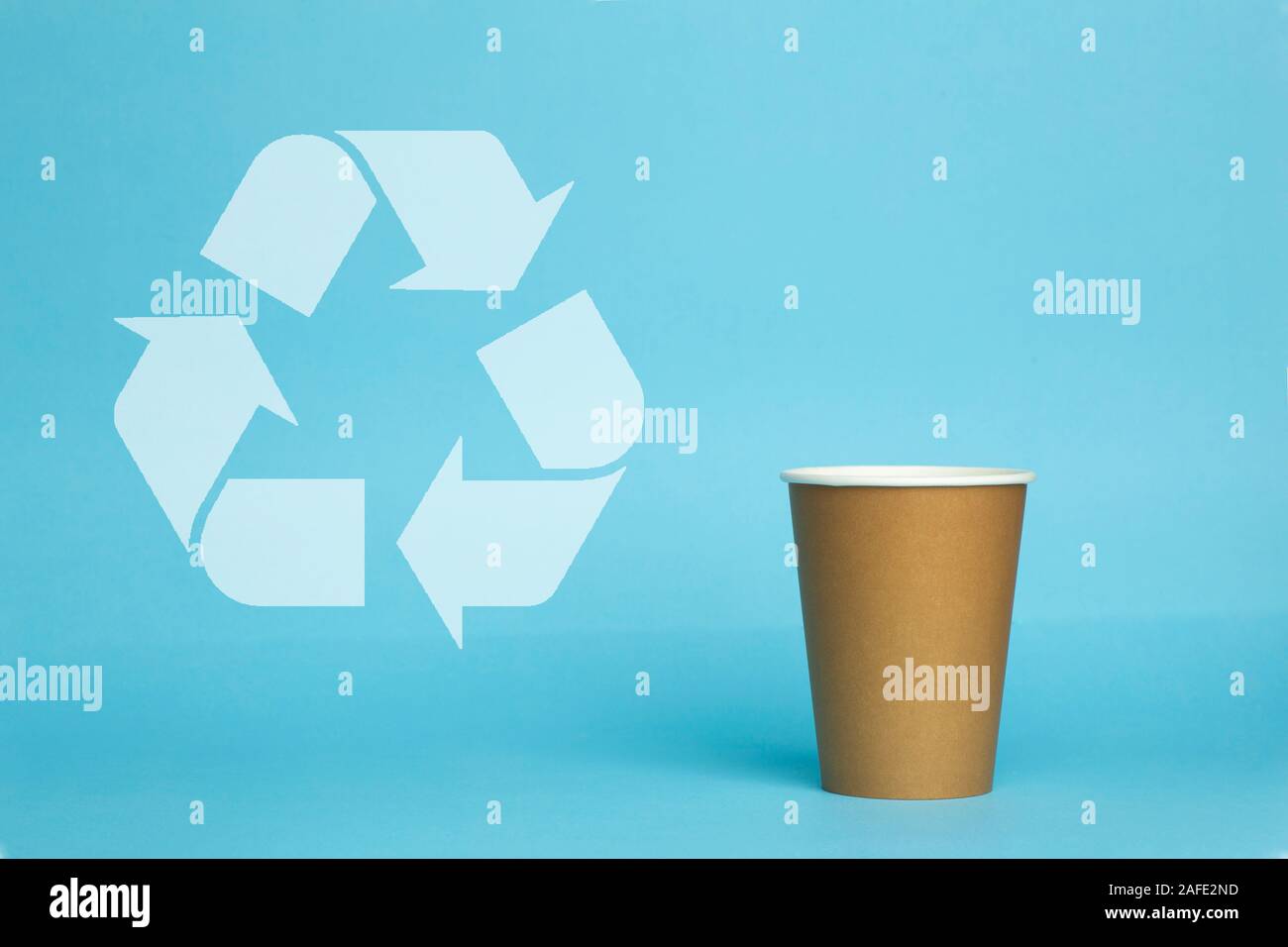 Paper cup for a drink on a blue background. Recycling of paper and ...