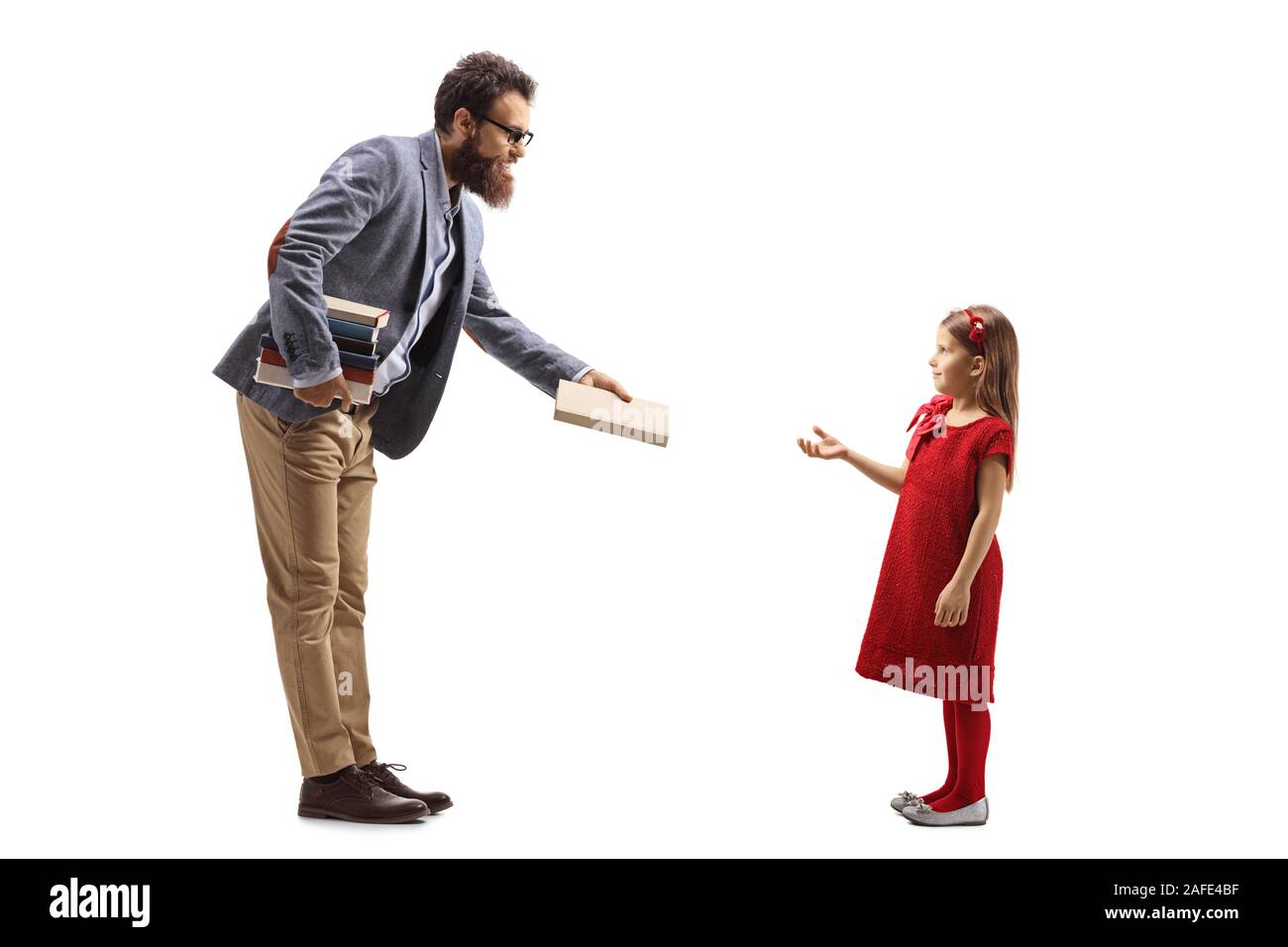Full length profile shot of a male teacher giving a book to a girl ...