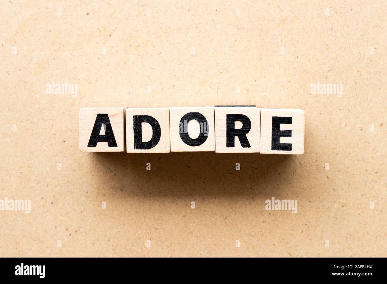 Letter block in word adore on wood background Stock Photo - Alamy