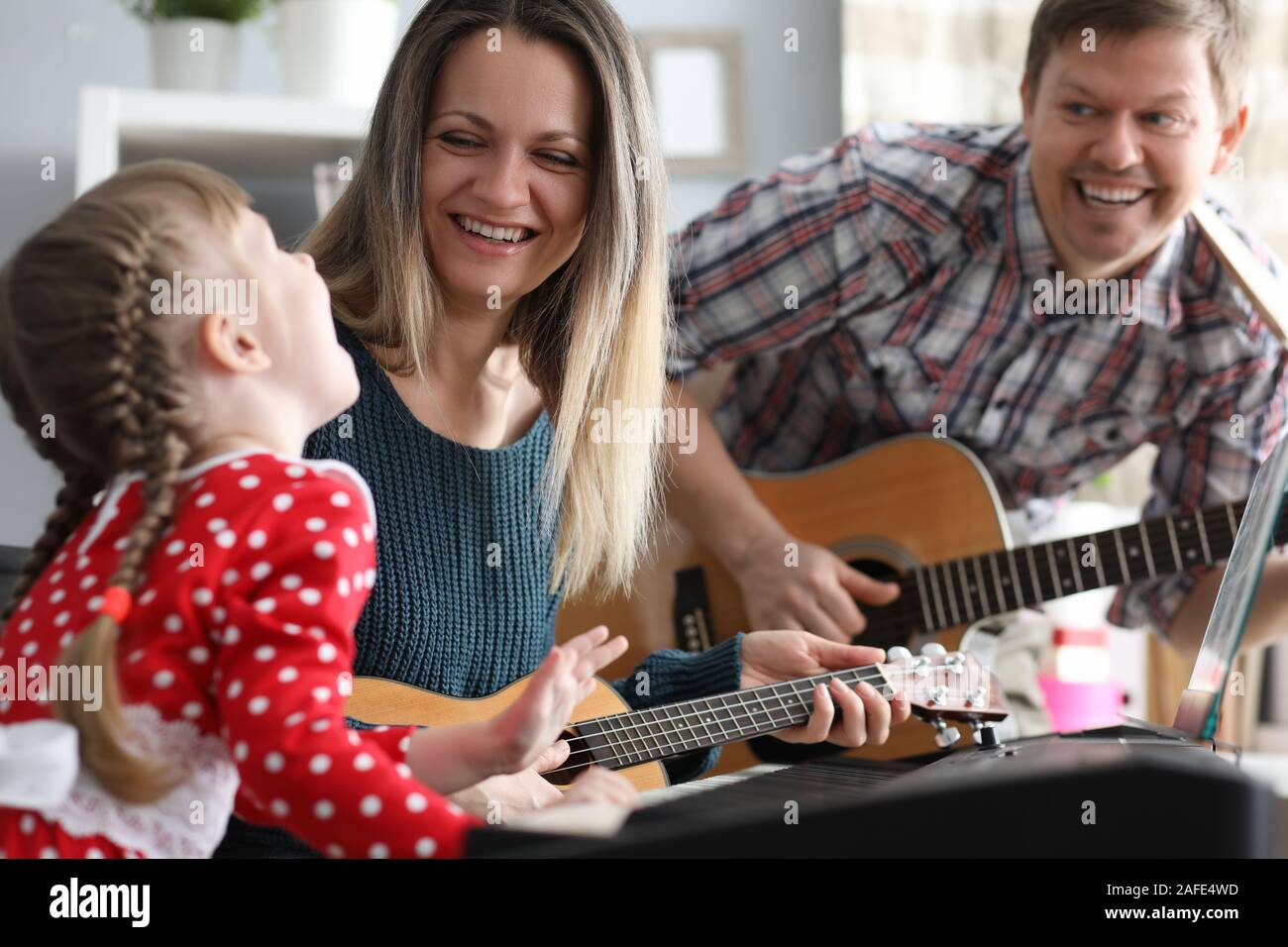 Friendly family at home Stock Photo - Alamy