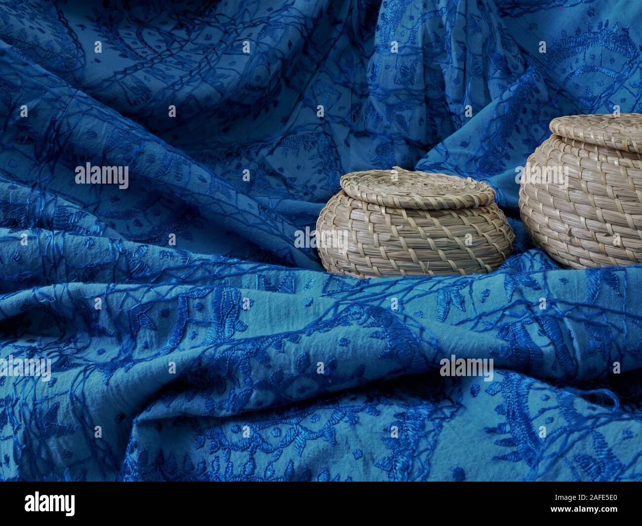 Blue indian arab textile tribal pattern and baskets closeup Stock Photo ...