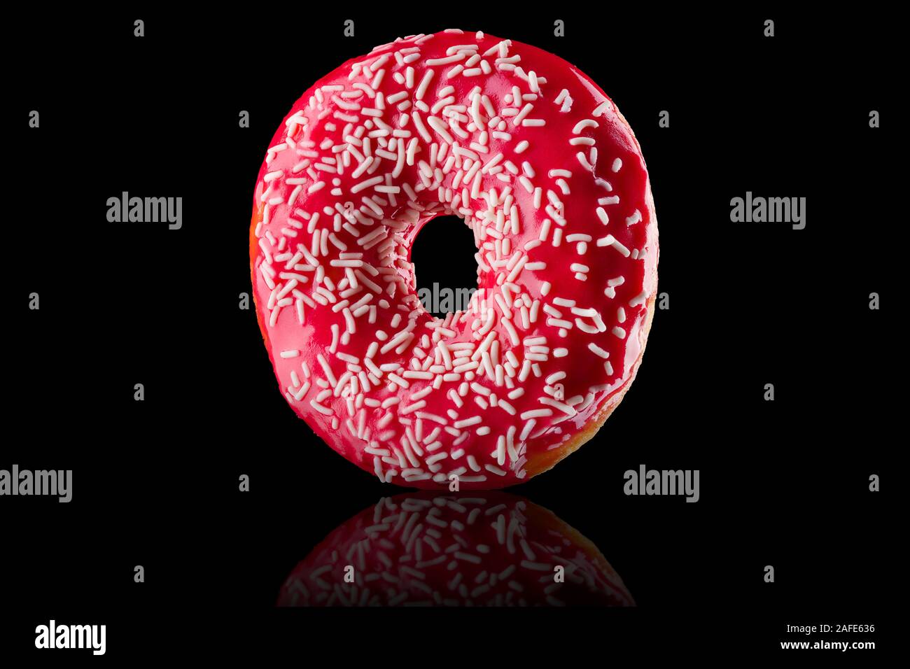 Glazed donut with reflection and clipping path on a black background ...