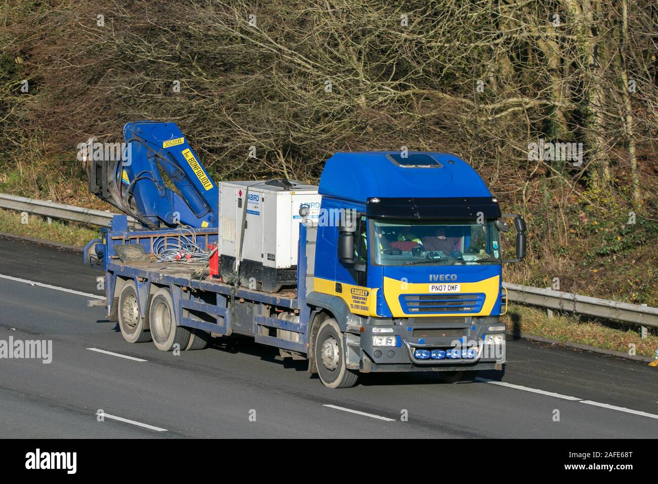 Causey transport Iveco truck transformer HIAB grab driving on the M61 ...