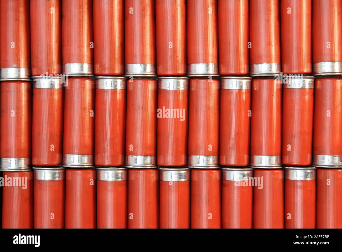 Red 20 gauge shotgun shells in a pattern laying flat Stock Photo - Alamy