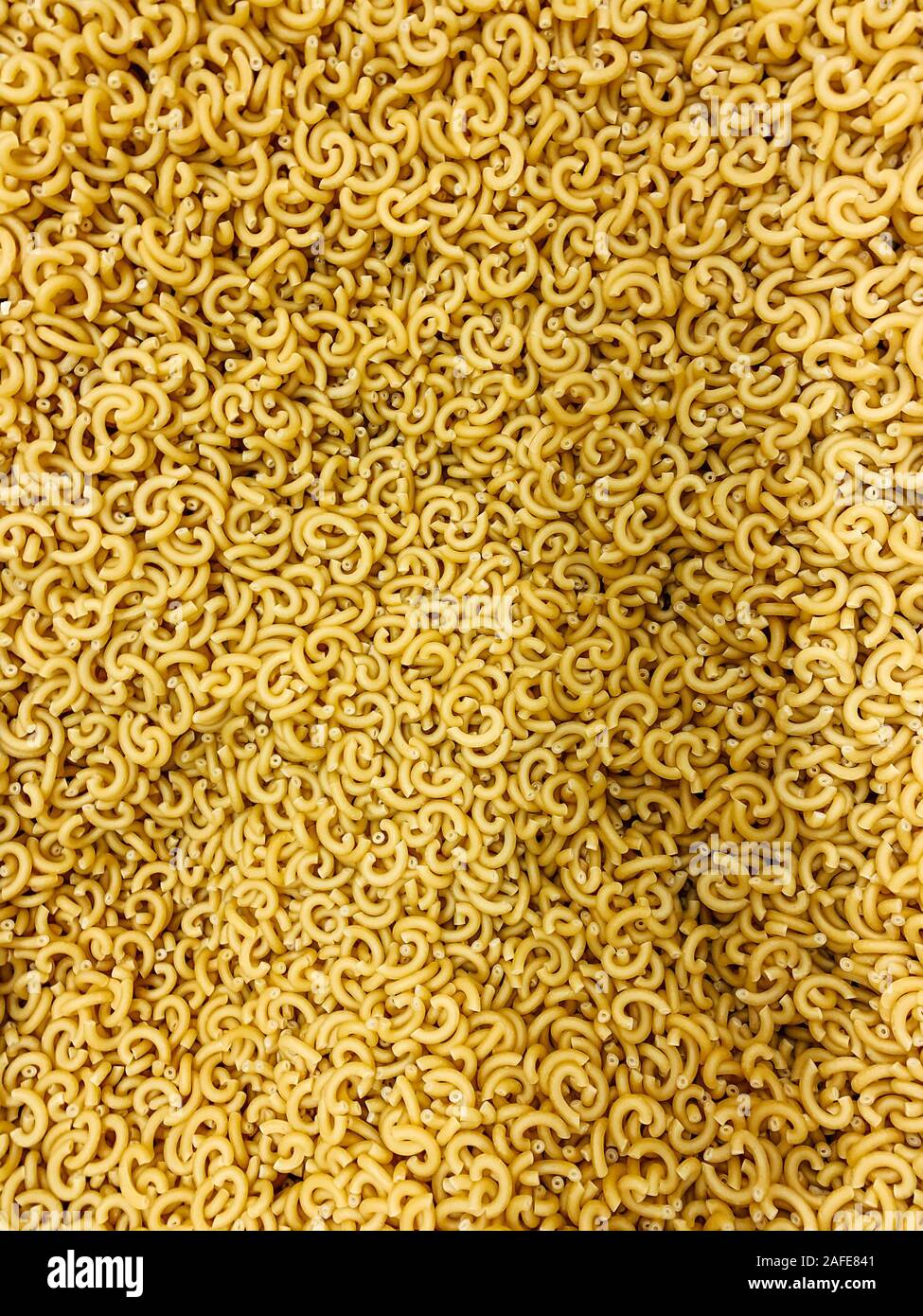 lots of pasta for cooking like a background Stock Photo - Alamy