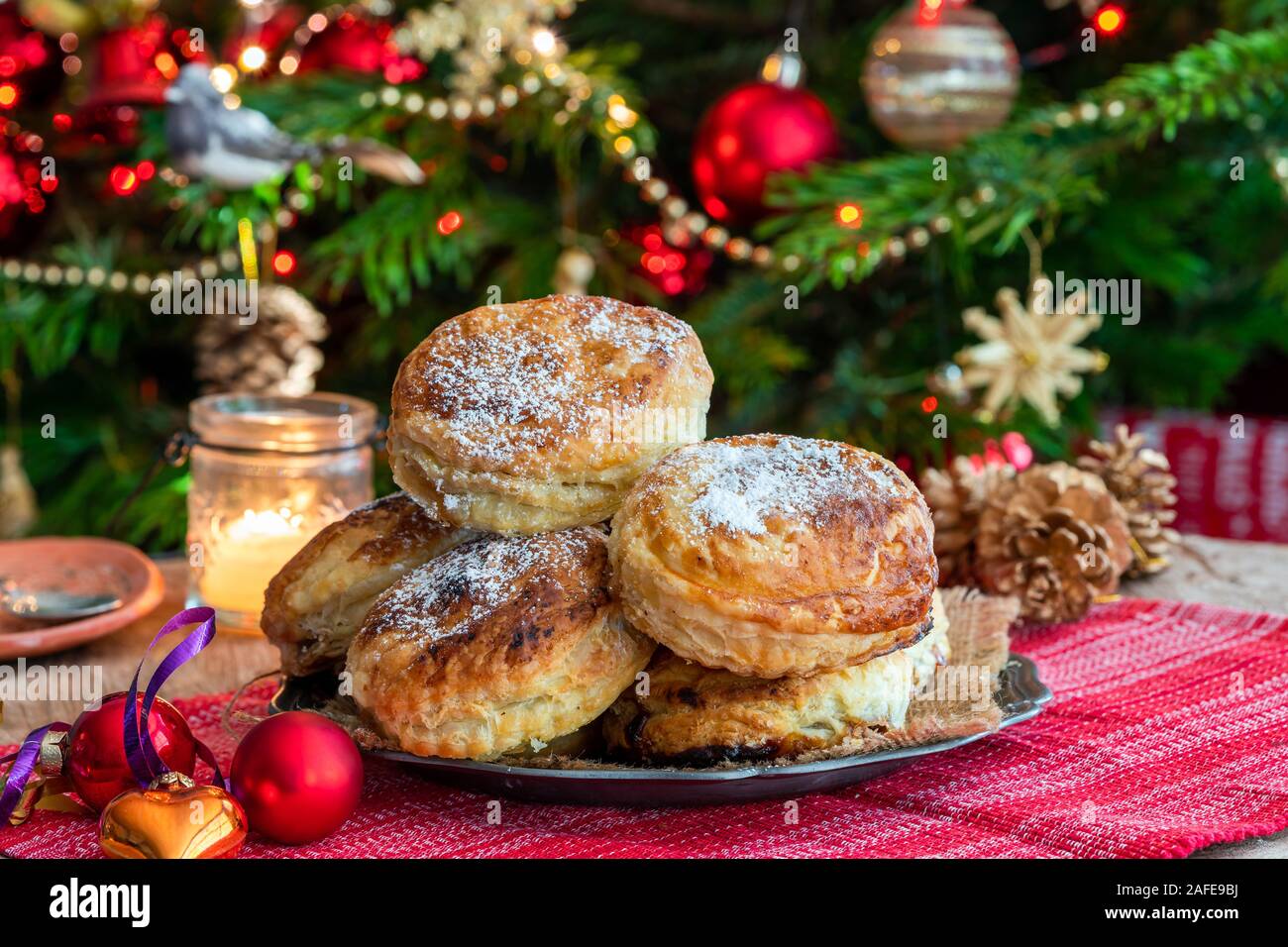 Homemade Christmas puff pastry mince pies with Christmas tree in the ...