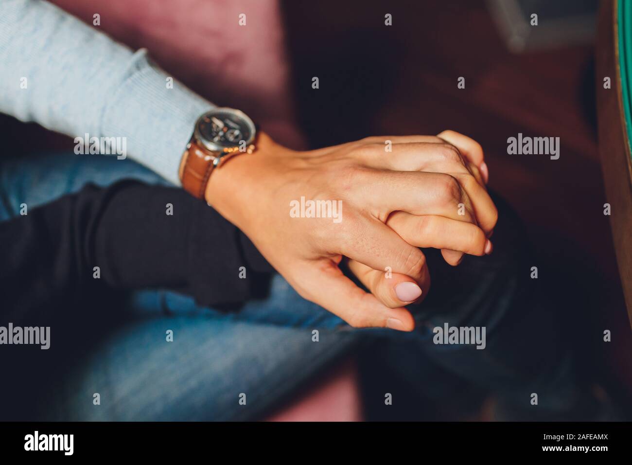 Man's hand gently holding woman's hand - closeup shot Stock Photo - Alamy