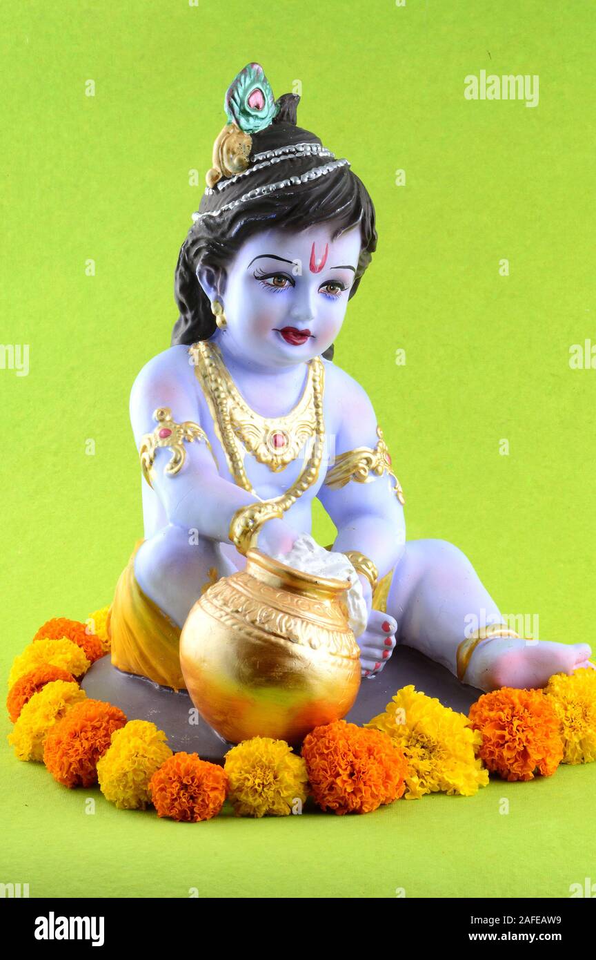 Hindu God Krishna on green background Stock Photo - Alamy