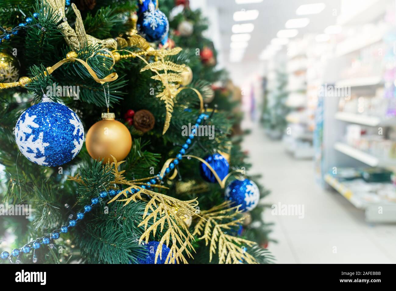 Christmas tree in the store, decorated with balloons, new year's ...
