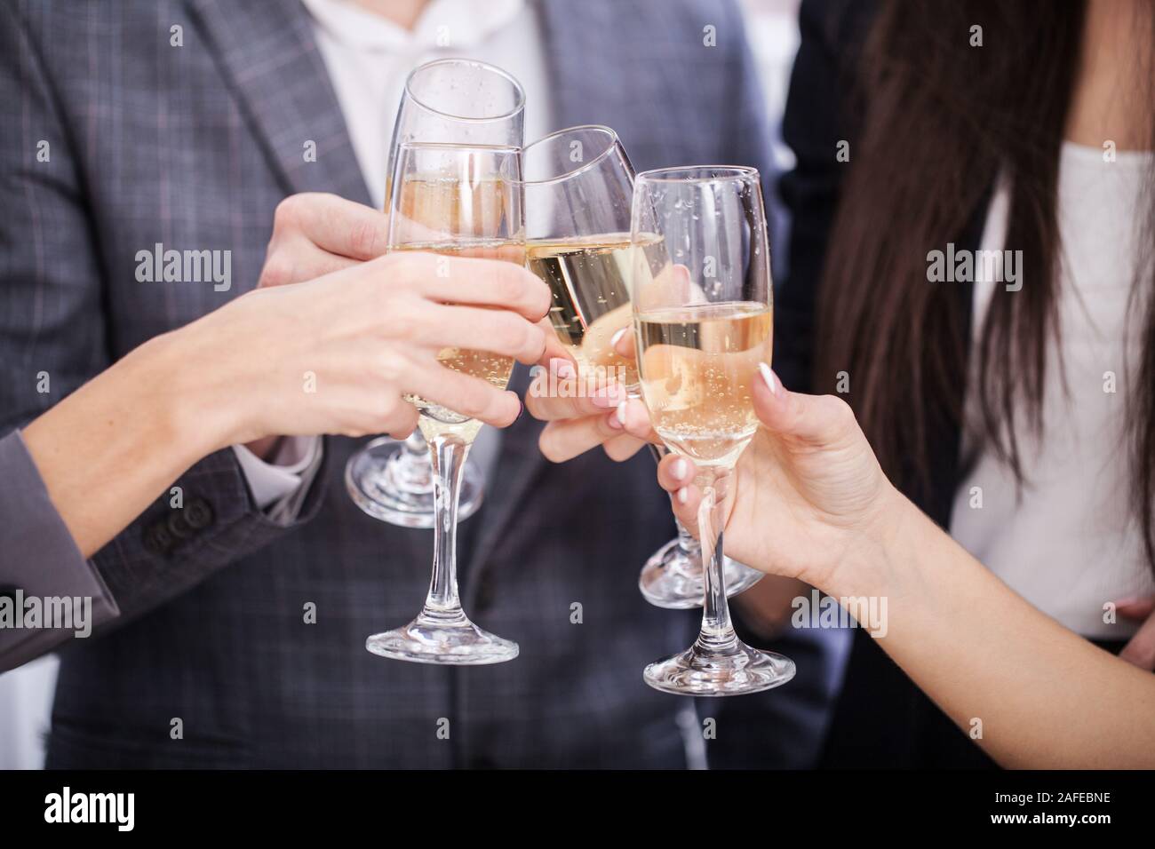 Team diverse happy colleagues toasting hi-res stock photography and ...