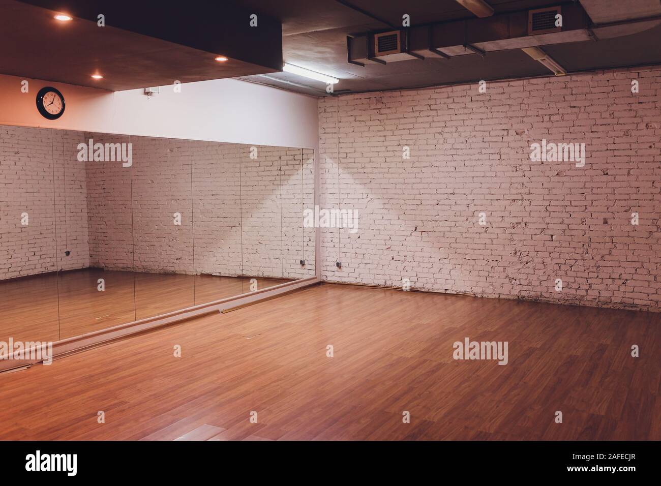 Interior of an empty dance and fitness studio with loft design and big ...