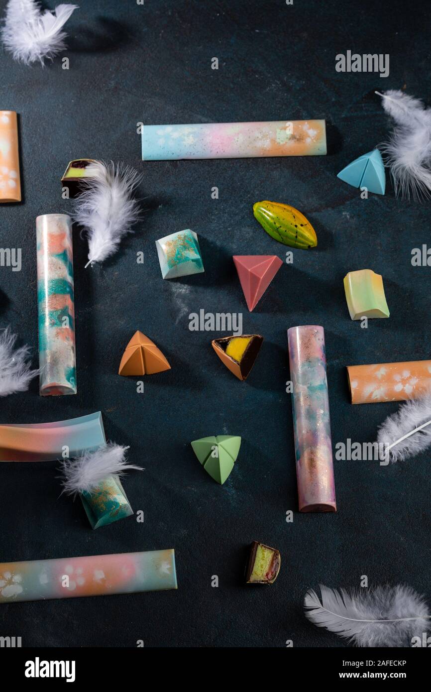 Modern chocolate candy on blue background Stock Photo - Alamy