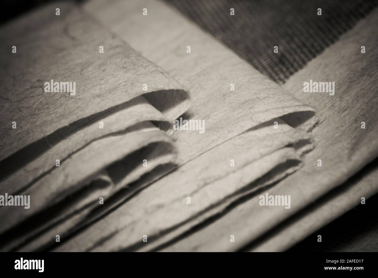 Macro shots folded a newspaper closeup picture Stock Photo - Alamy