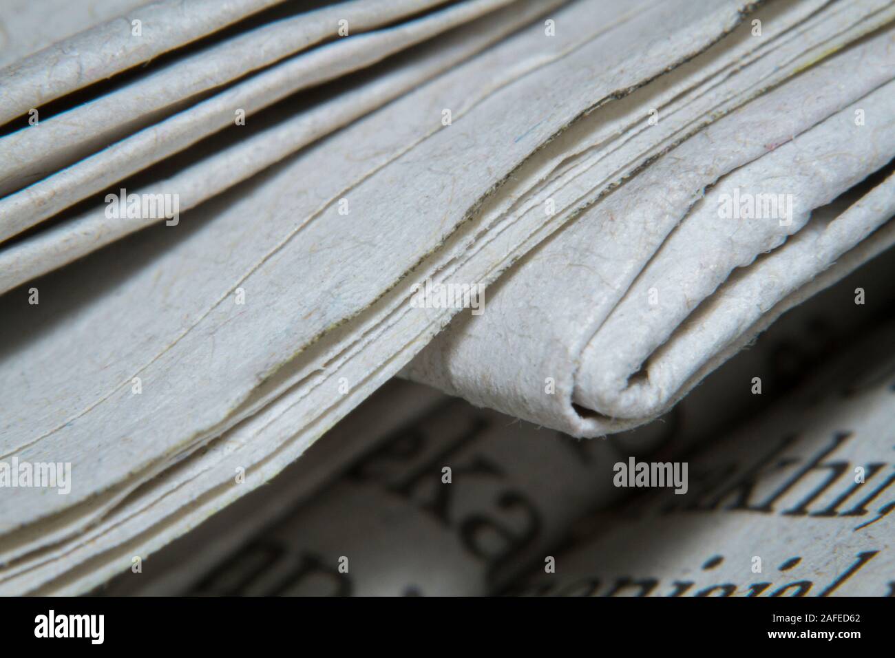 Macro shots folded a newspaper closeup picture Stock Photo - Alamy
