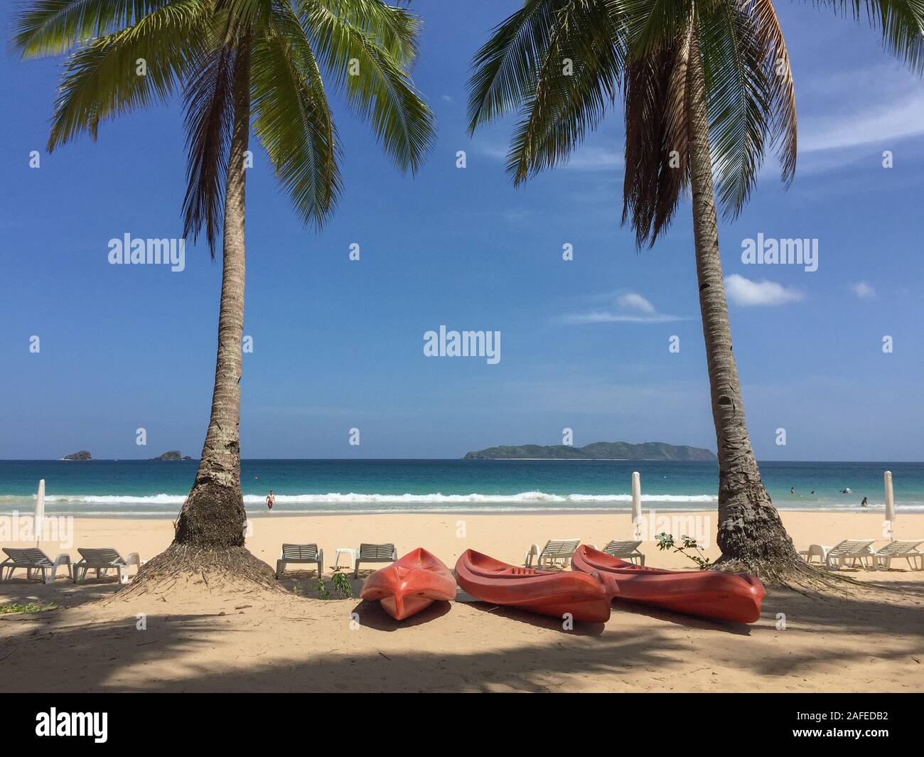 Red kayak on beautiful beach in Coron Island, Philippines. Coron is one ...