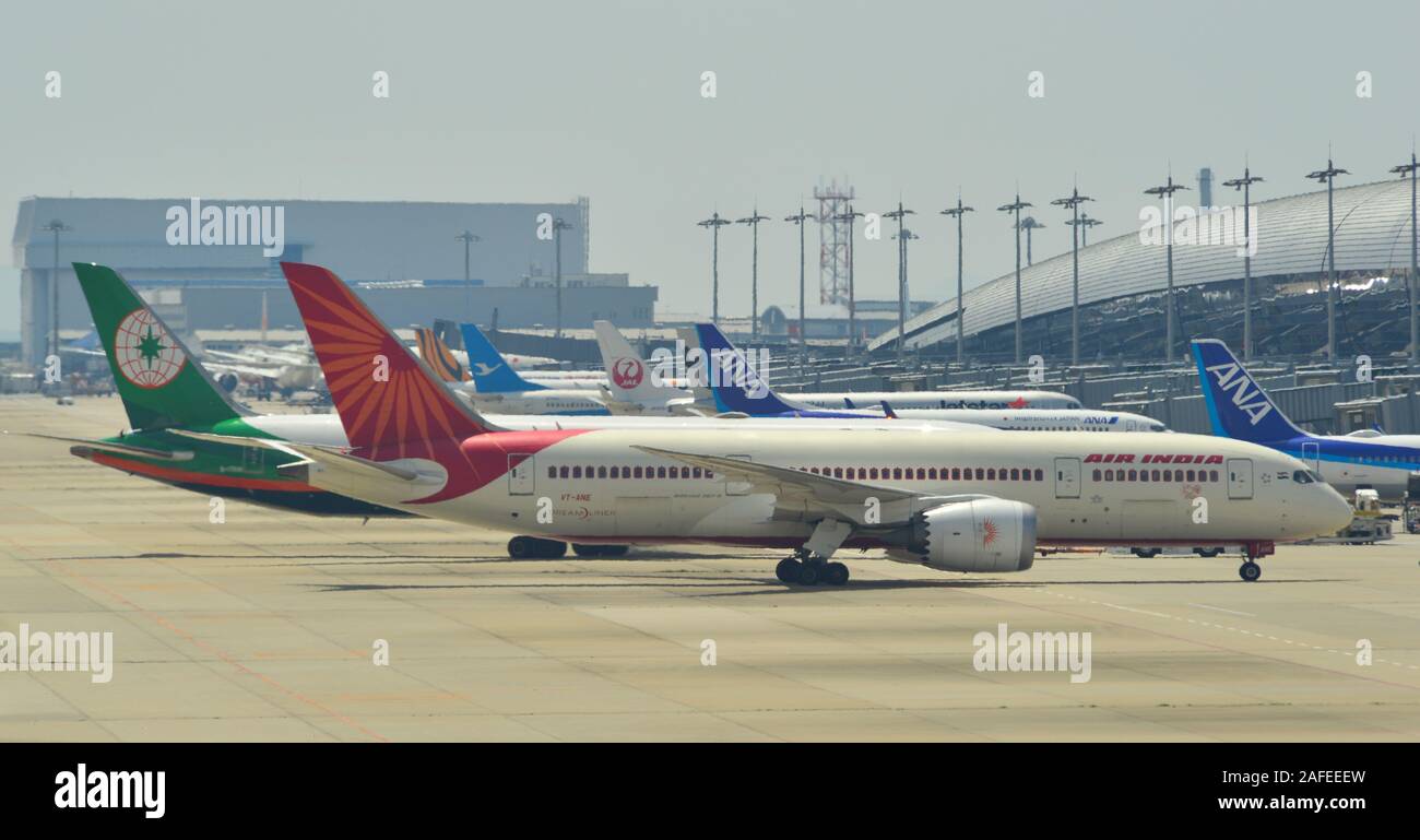 Osaka, Japan - Apr 18, 2019. Passenger airplanes taxiing on runway of ...