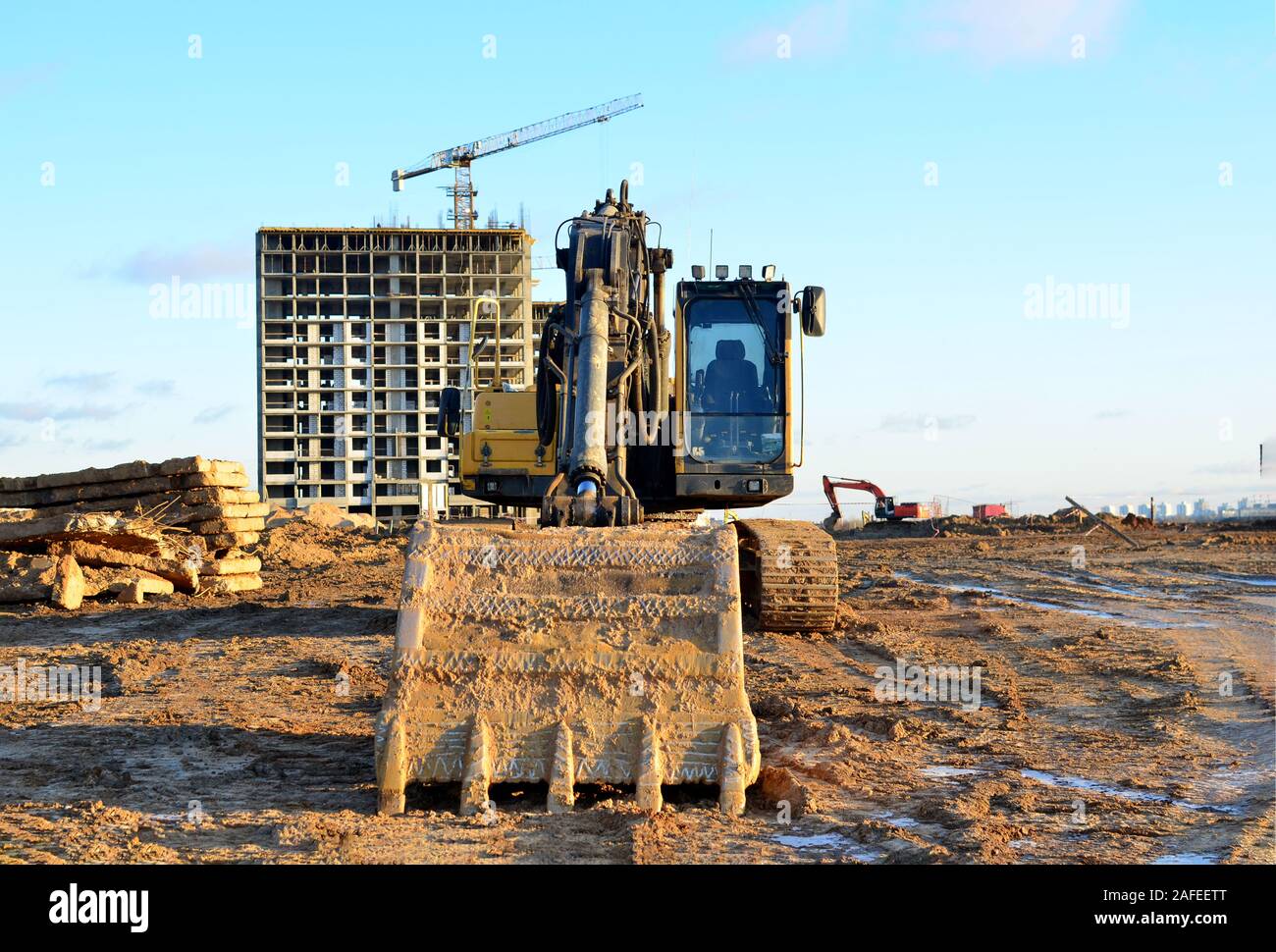 Excavator at a construction site on a background of a construction ...