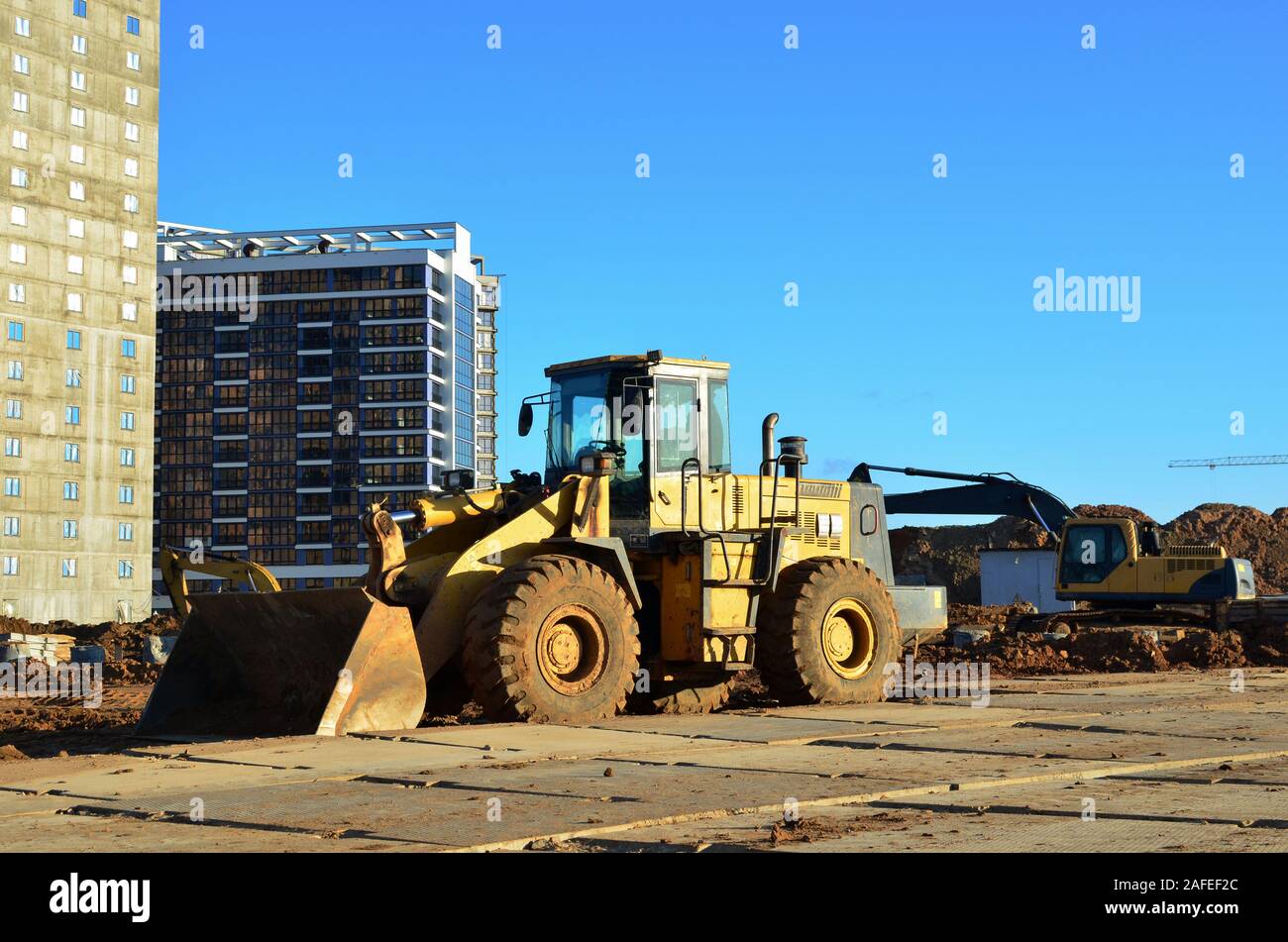 Front-end loader working on construction site during the renovation of ...