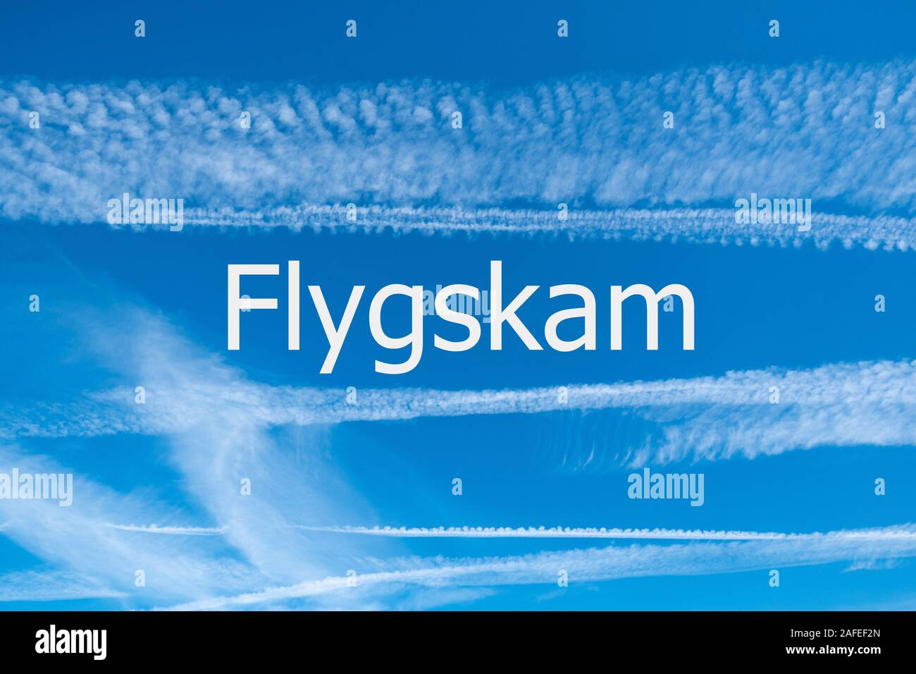 Climate change and flygskam concept image with blue sky and vapour ...