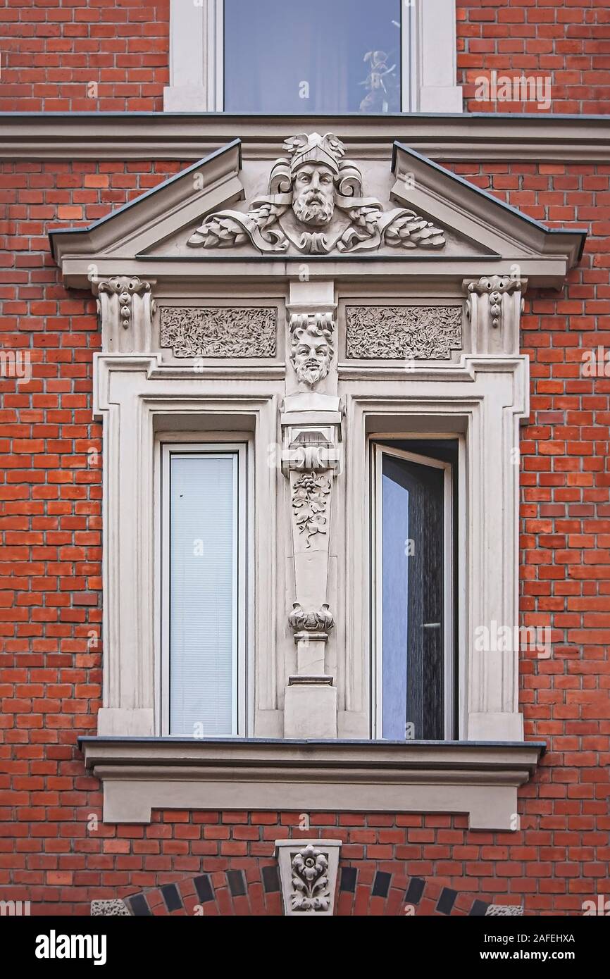 Old tenement house with brick wall detail window with german stucco ...