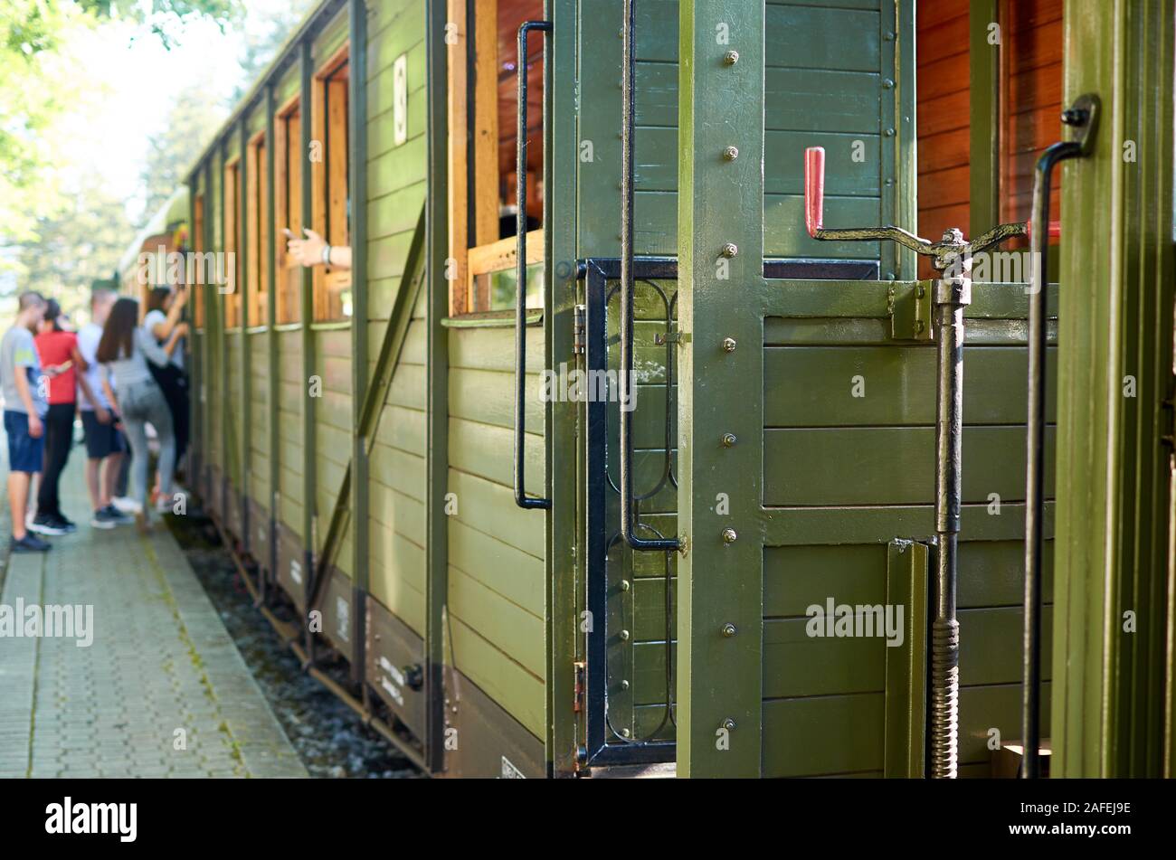 Train wagons with young people getting on a train Stock Photo - Alamy