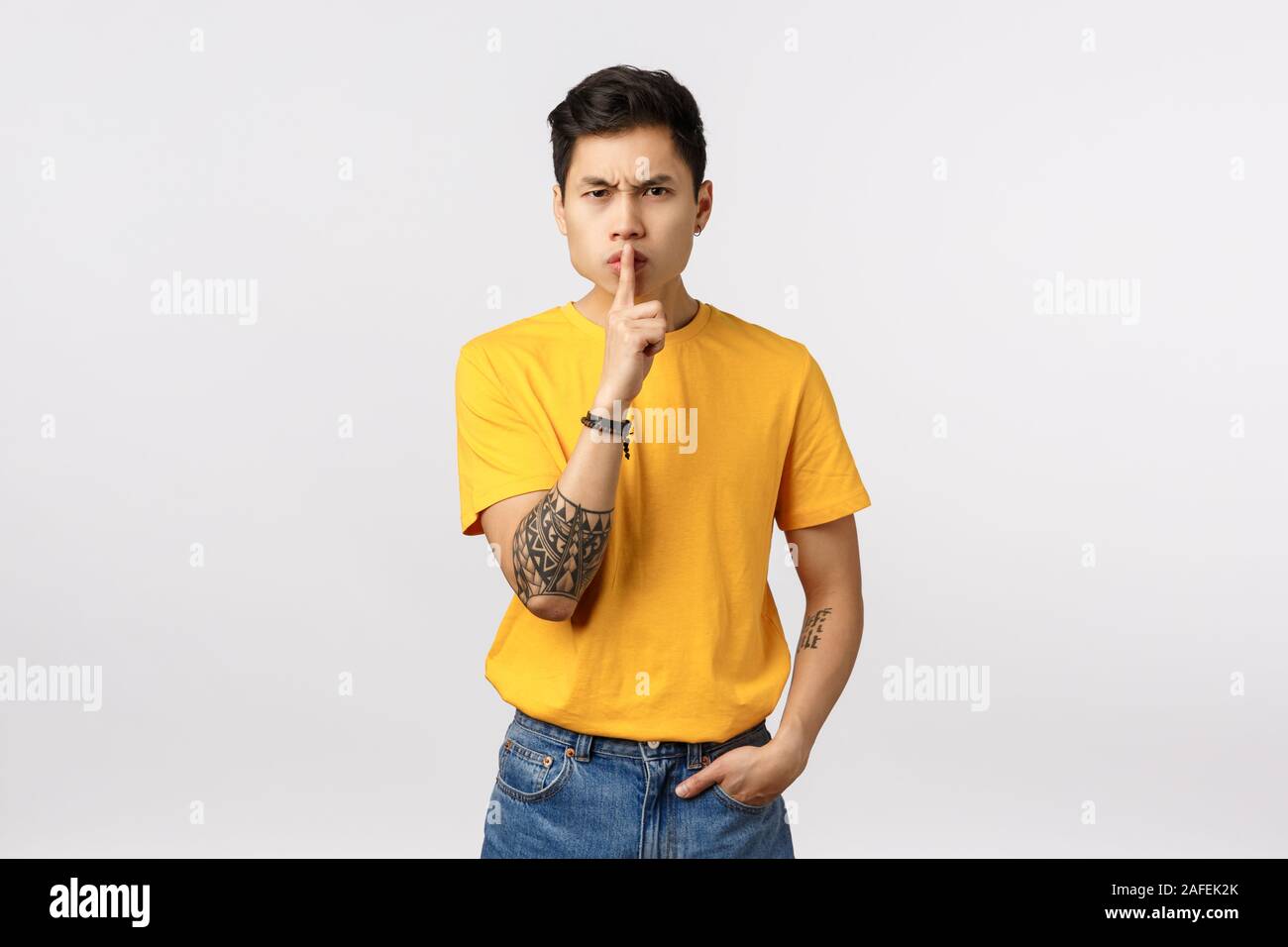 Shut your mouth. Aggressive serious-looking and displeased, strict ...