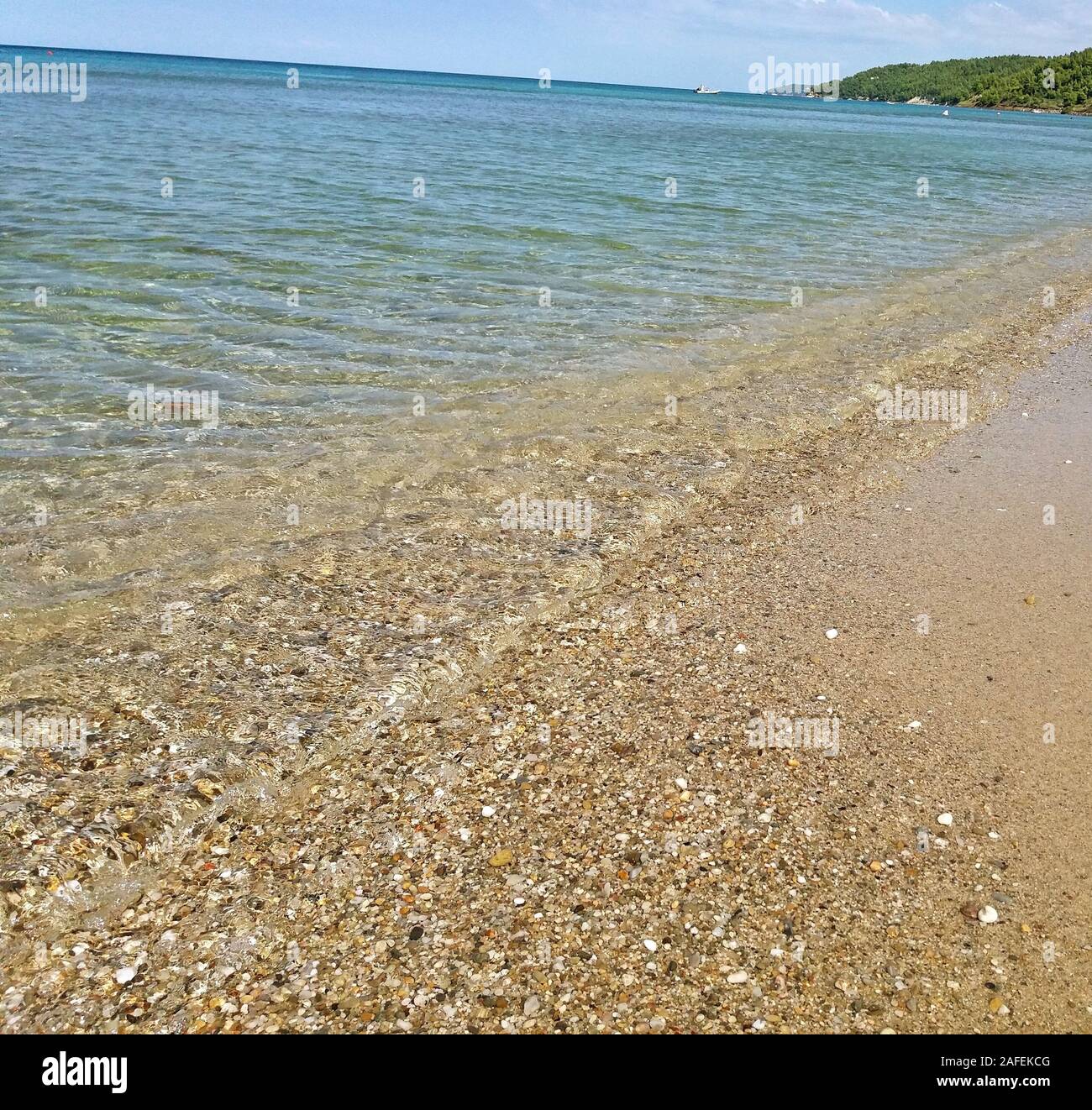 The Mediterranean Sea in Greece, clear green and blue water Stock Photo ...