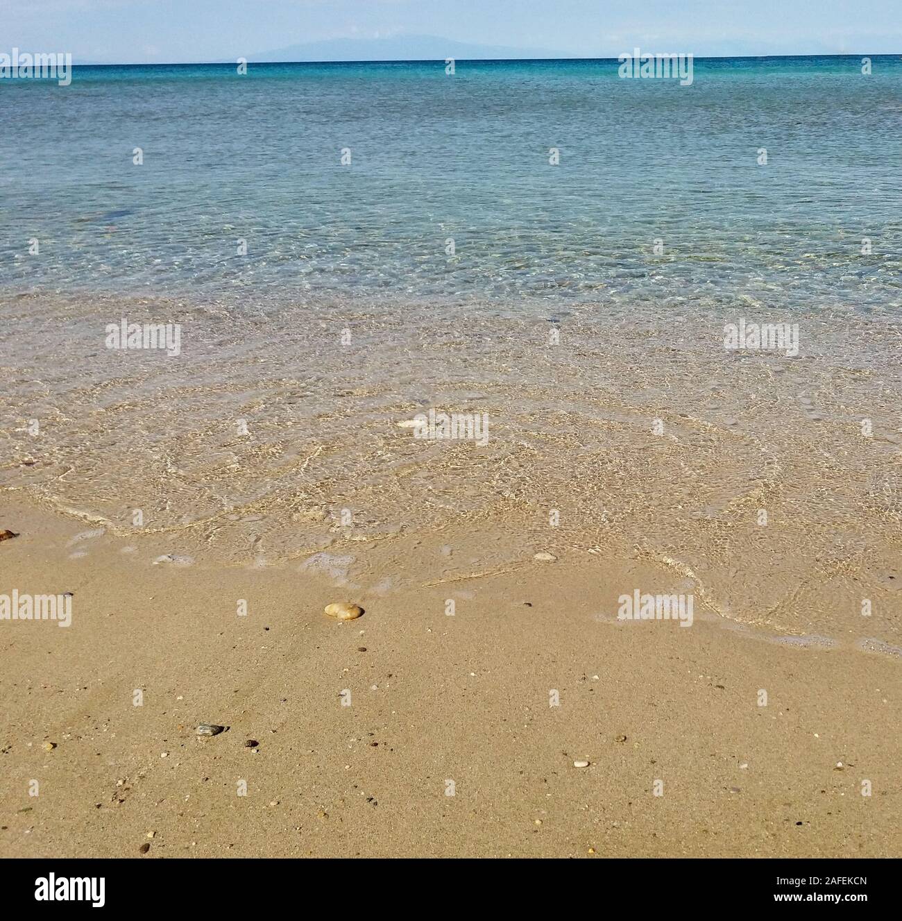 The Mediterranean Sea in Greece, clear green and blue water Stock Photo ...