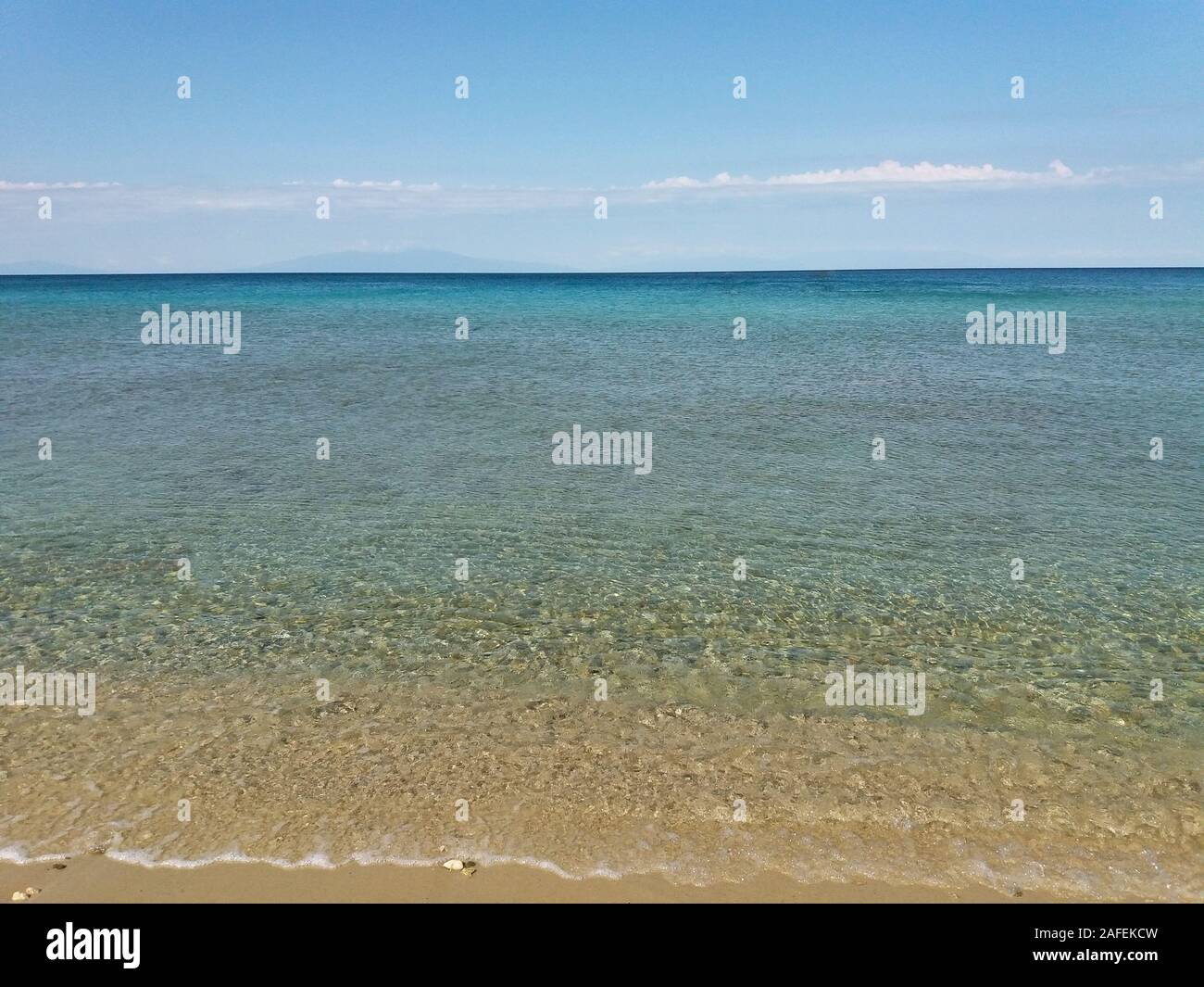 The Mediterranean Sea in Greece, clear green and blue water Stock Photo ...
