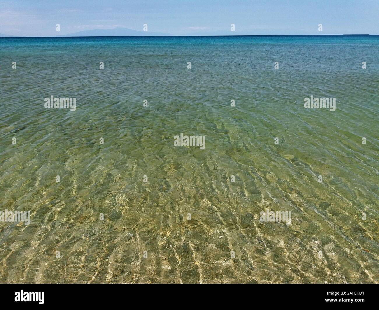 The Mediterranean Sea in Greece, clear green and blue water Stock Photo ...