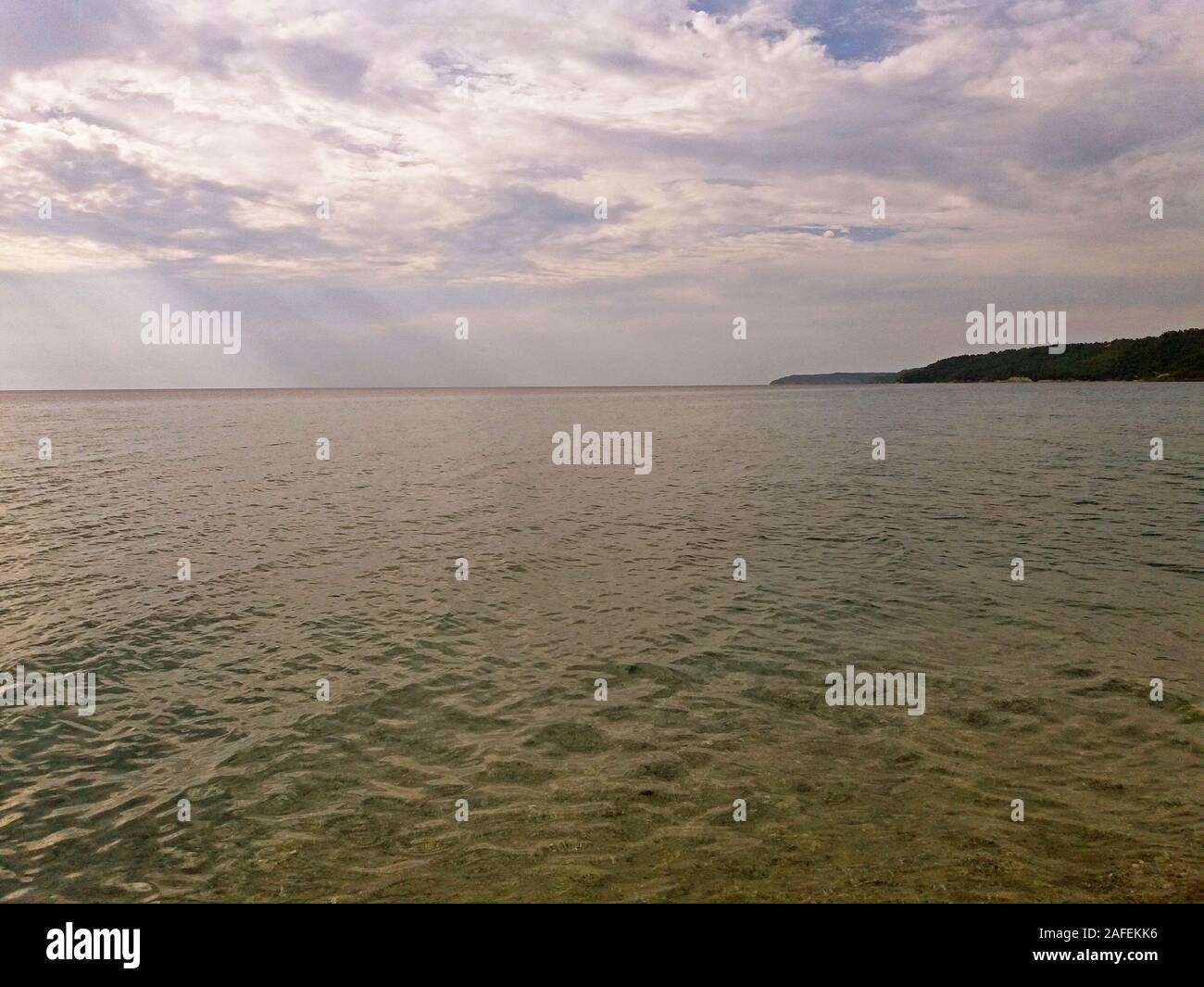 The rays of the sun over the Greek Mediterranean Sea Stock Photo - Alamy