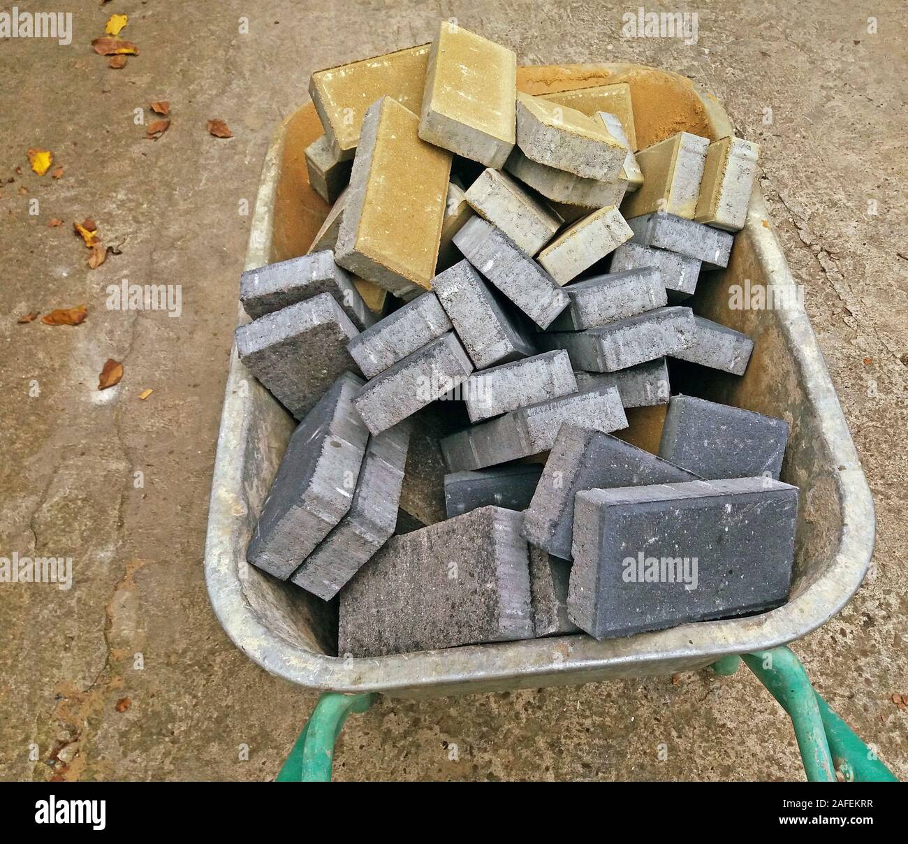 Wheelbarrow full of sand hi-res stock photography and images - Alamy