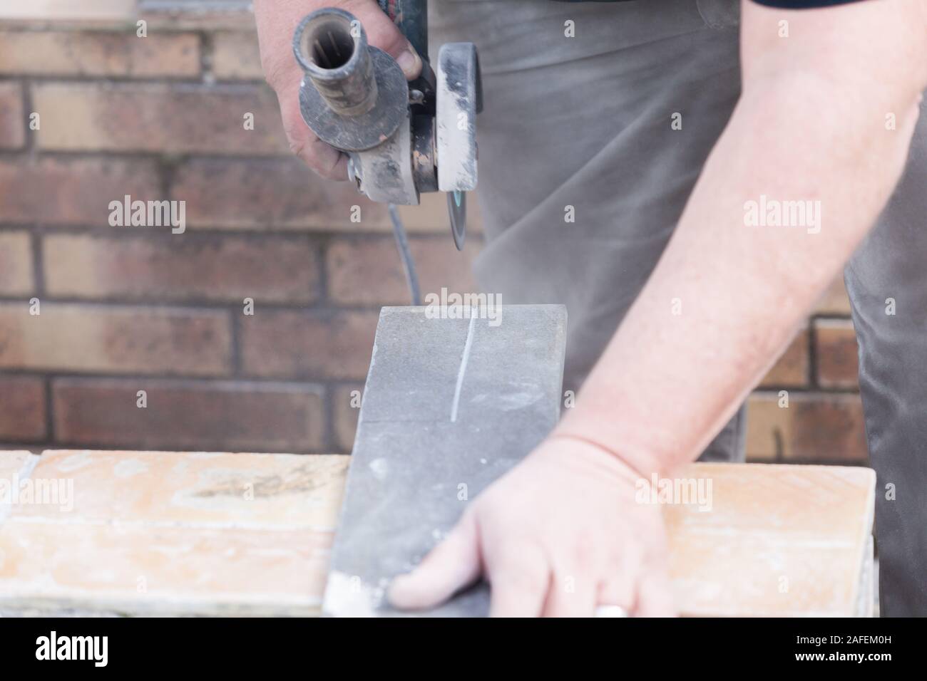 Professional tiler grinding tiles hi-res stock photography and images ...