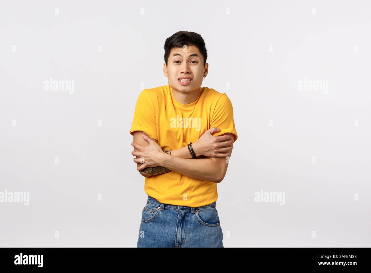 Turn on heater its freaking cold. Handsome young asian guy shaking ...