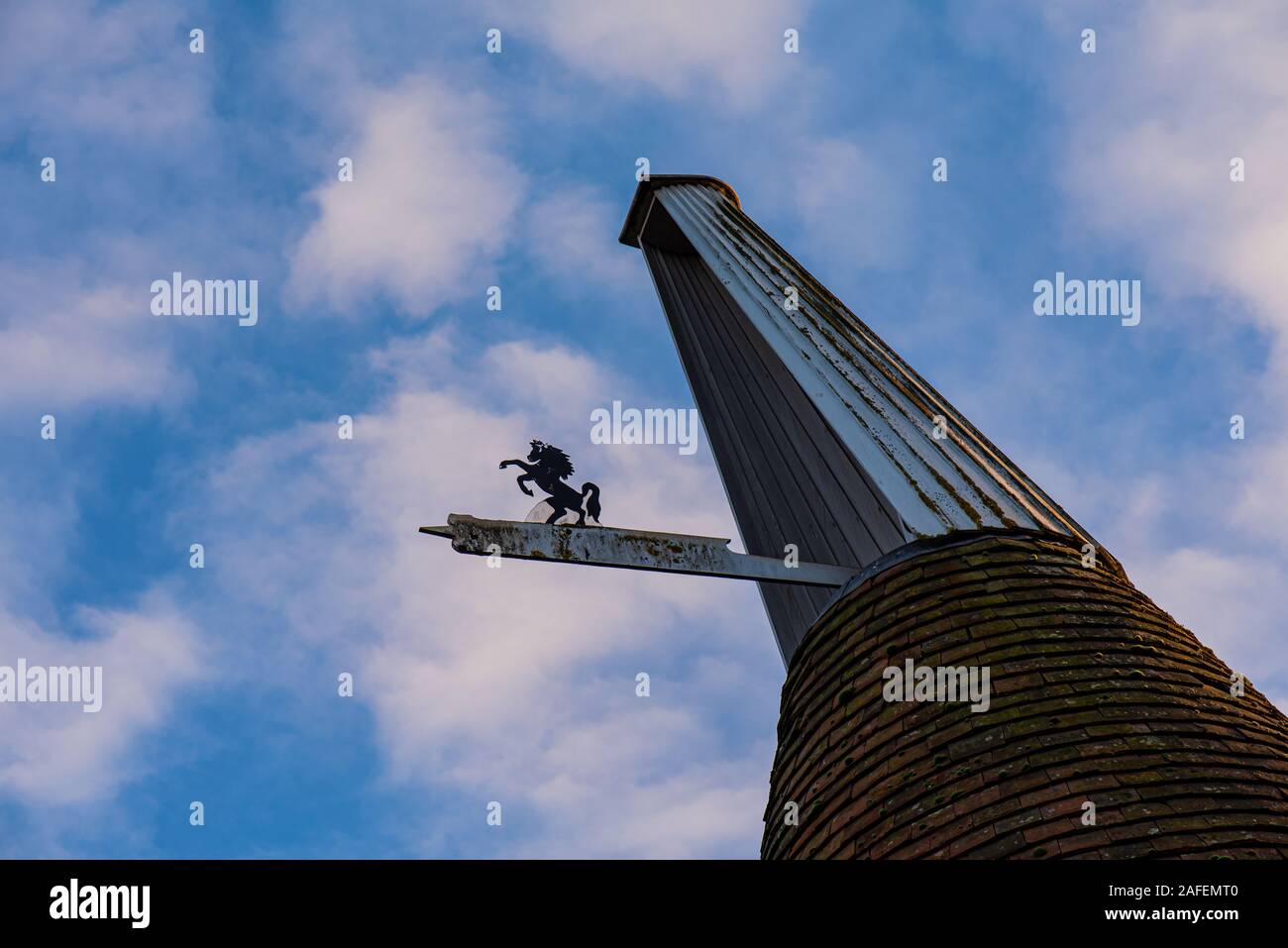amazing weathercock in the cloudy sky background Stock Photo - Alamy