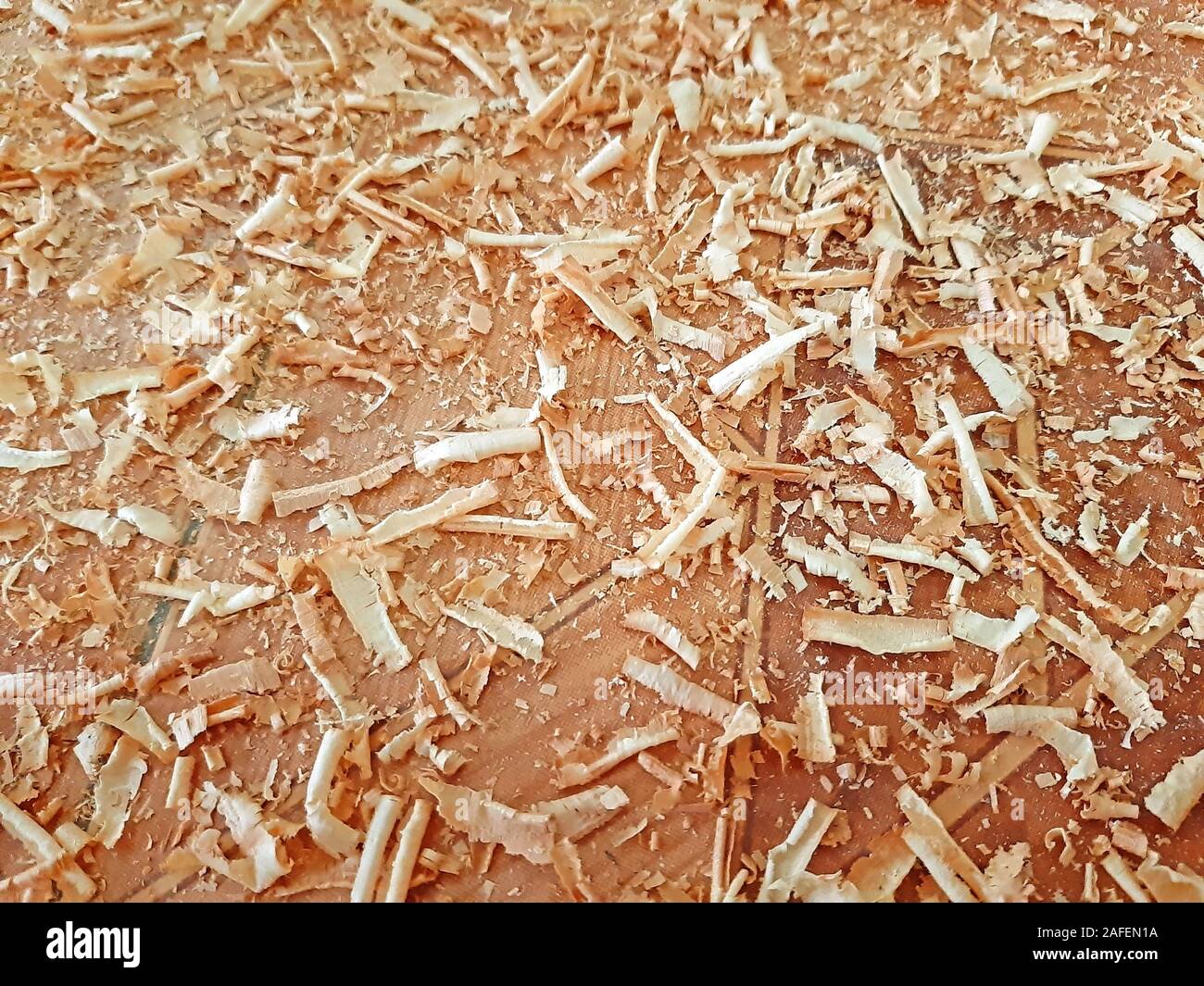 Sawdust on wooden background texture close up Stock Photo - Alamy