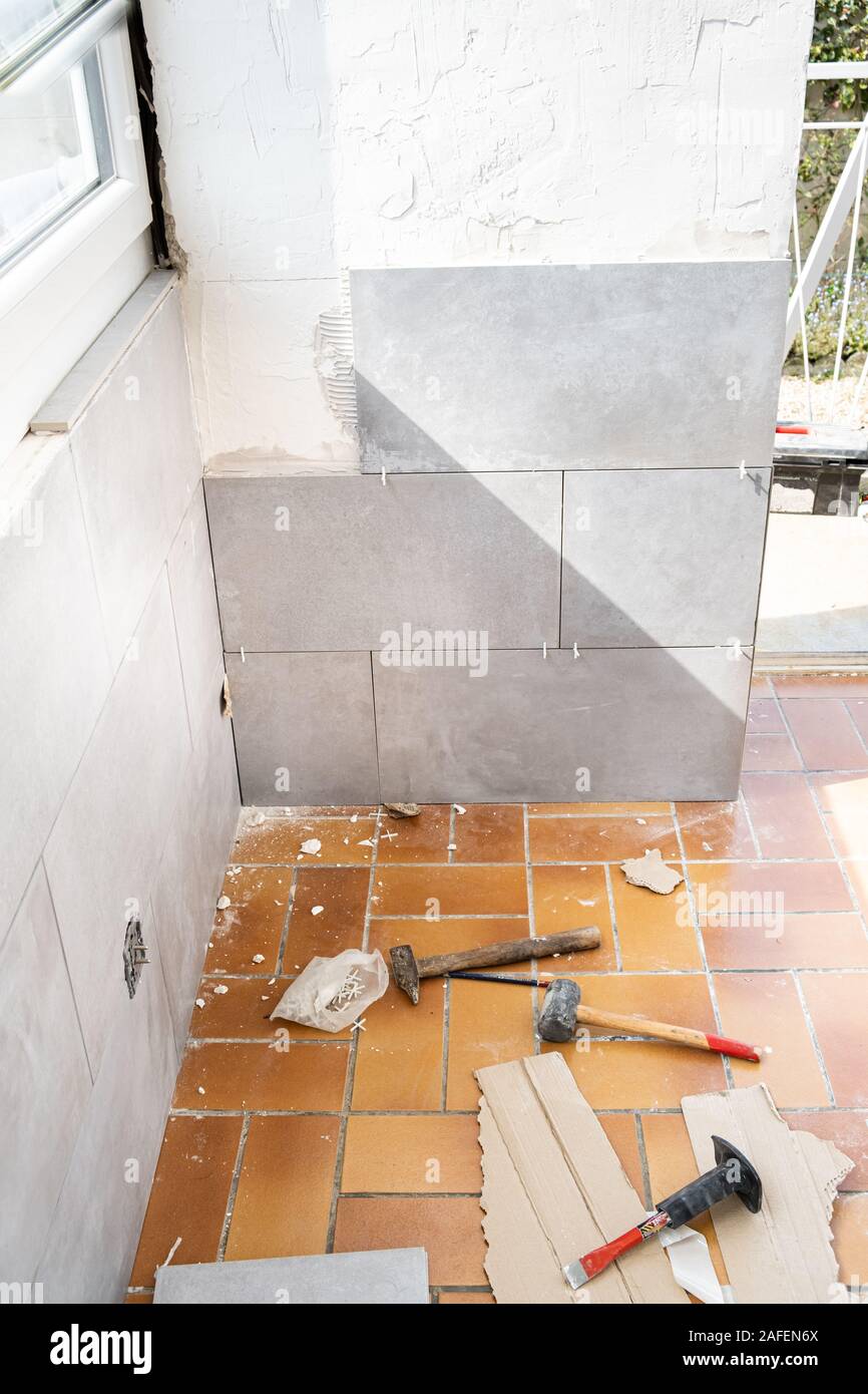 ceramic tile installation site with its tools Stock Photo - Alamy