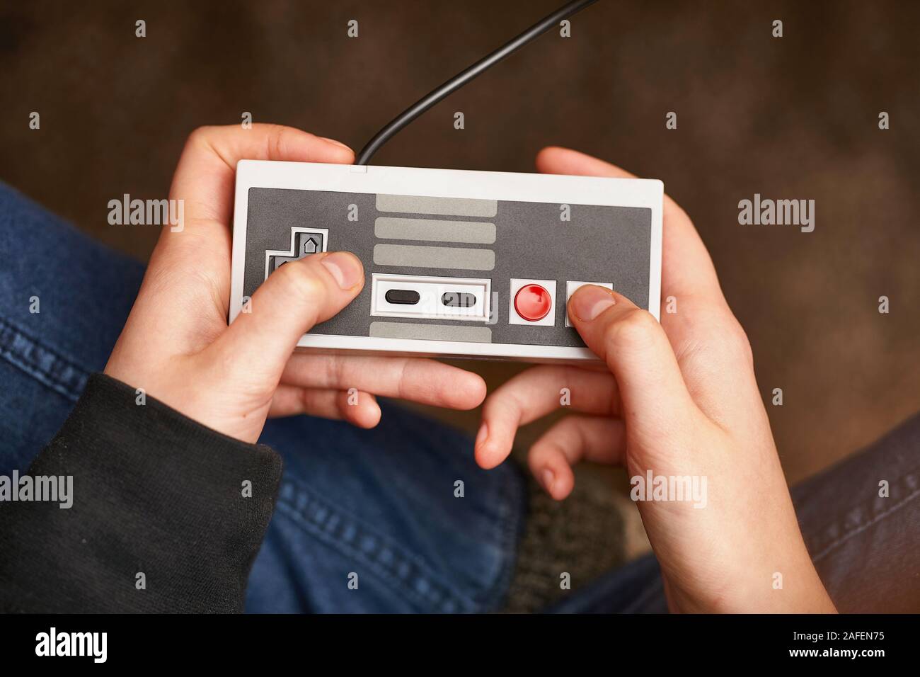 Playing an old gaming console Stock Photo - Alamy