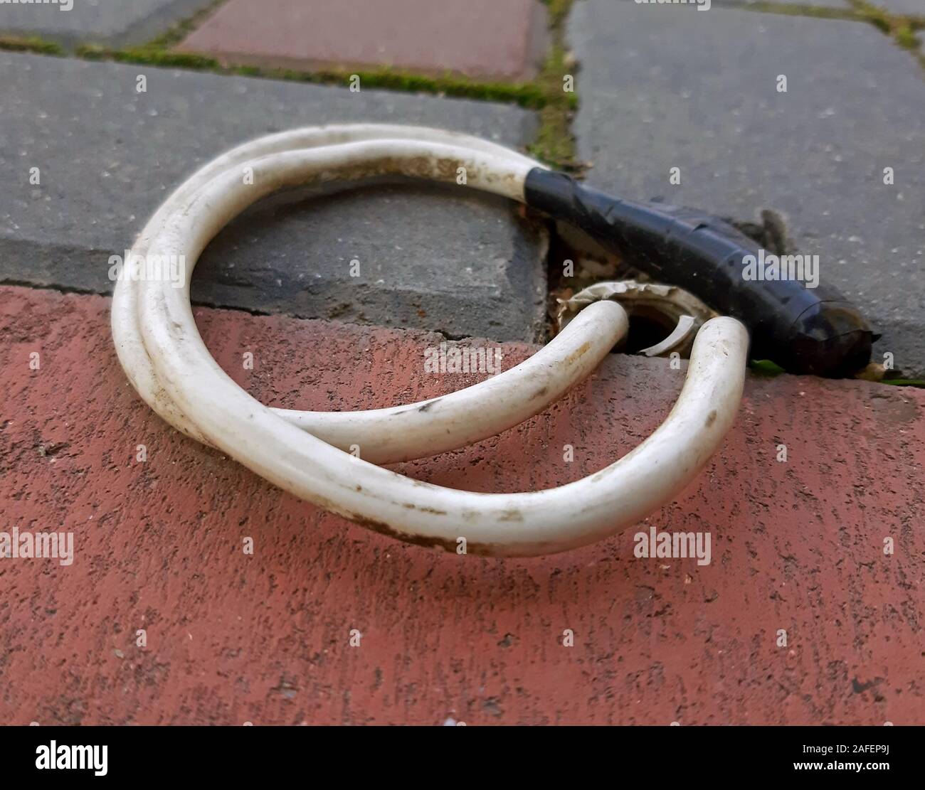 Electric cable installed under pavement, light installation concept ...