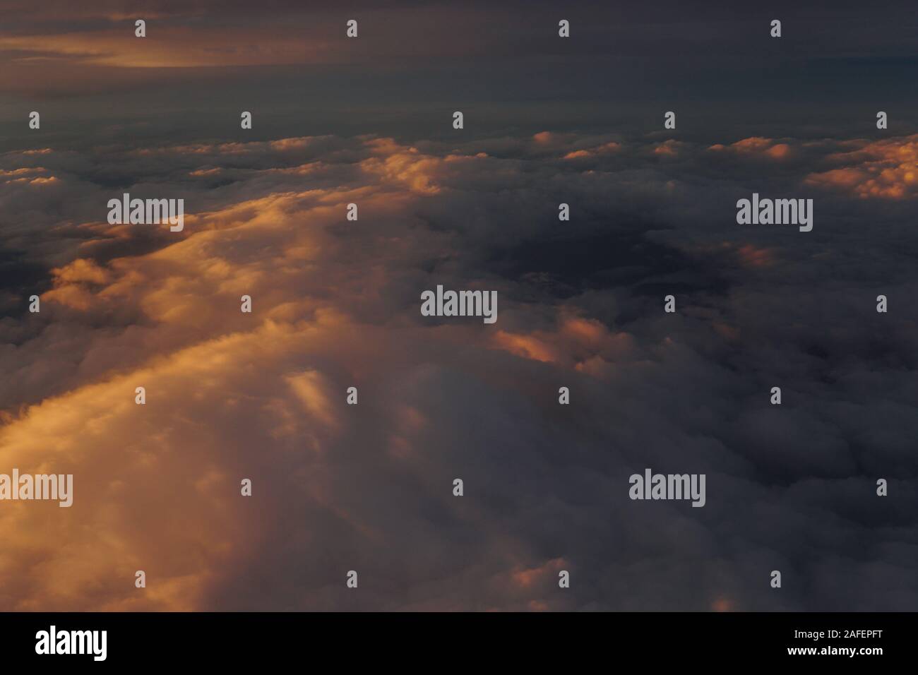 Sky with clouds at sunset from inside the plane landscape Stock Photo ...