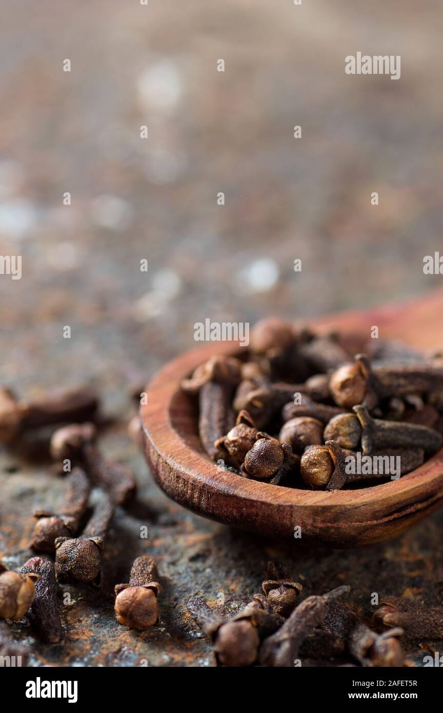 Cloves on a textured background. Spices, Food and cuisine ingredients ...